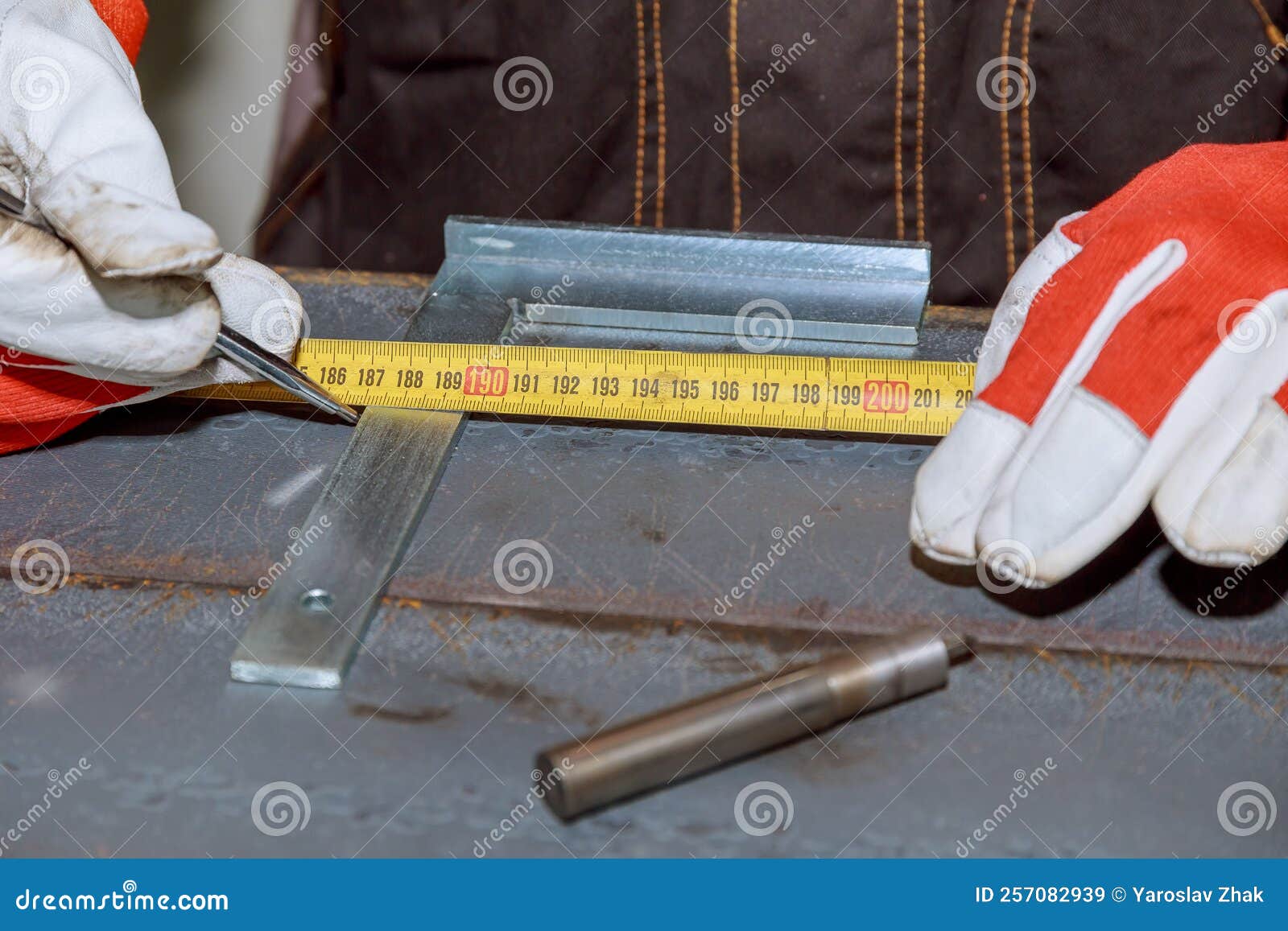 The Worker Measures the Required Distance on the Iron Surface Using a ...