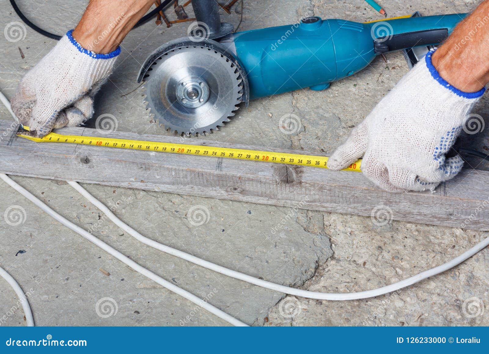 The Worker Measures the Ruler with the Distance on Wooden Board Stock ...