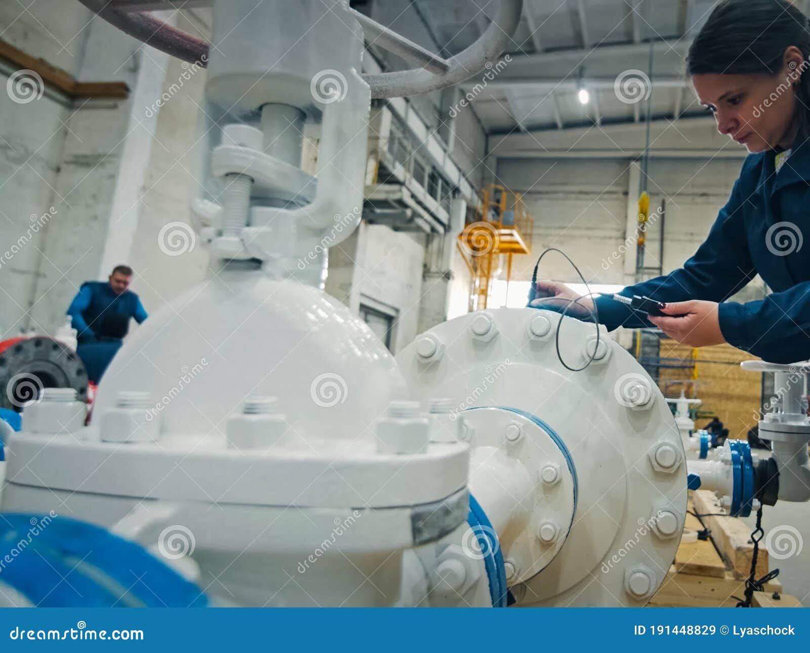 Worker Measures the Thickness of the Pipe. Checking the Pipes at ...