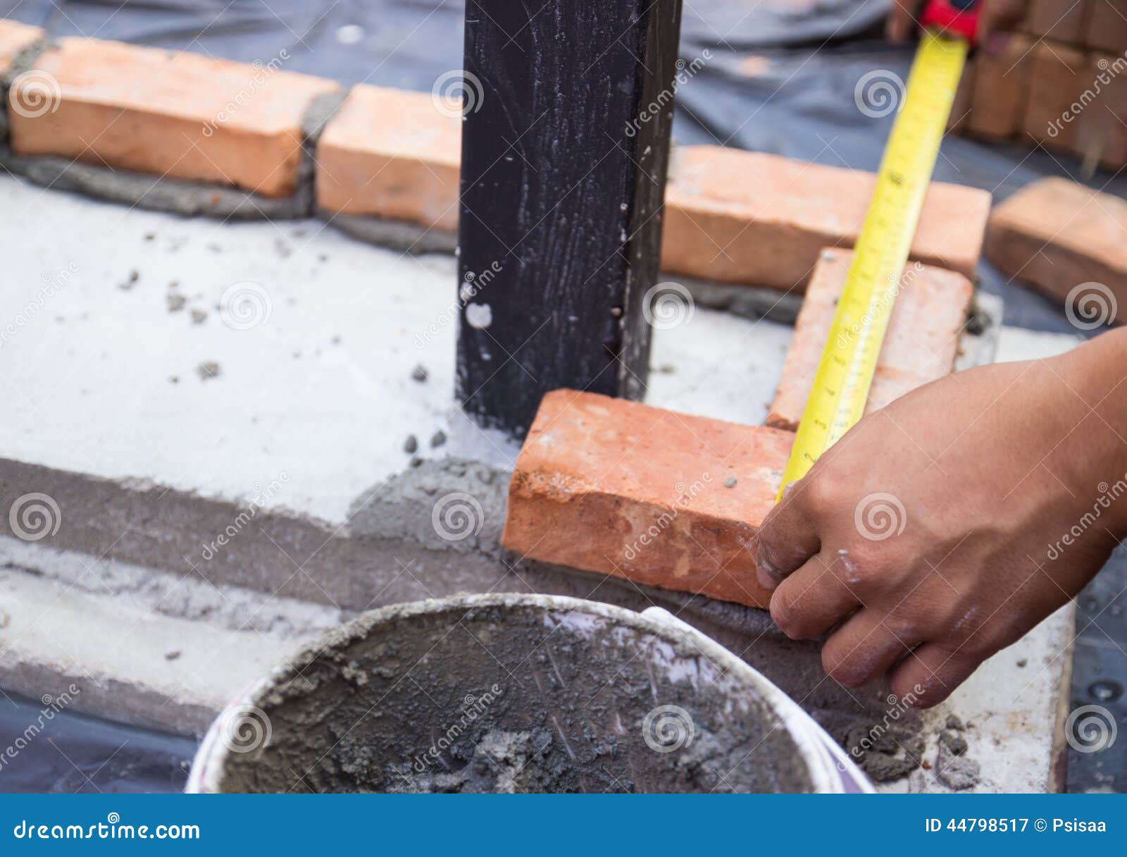 The Worker is Measuring the Brick Stock Image - Image of home, mason ...