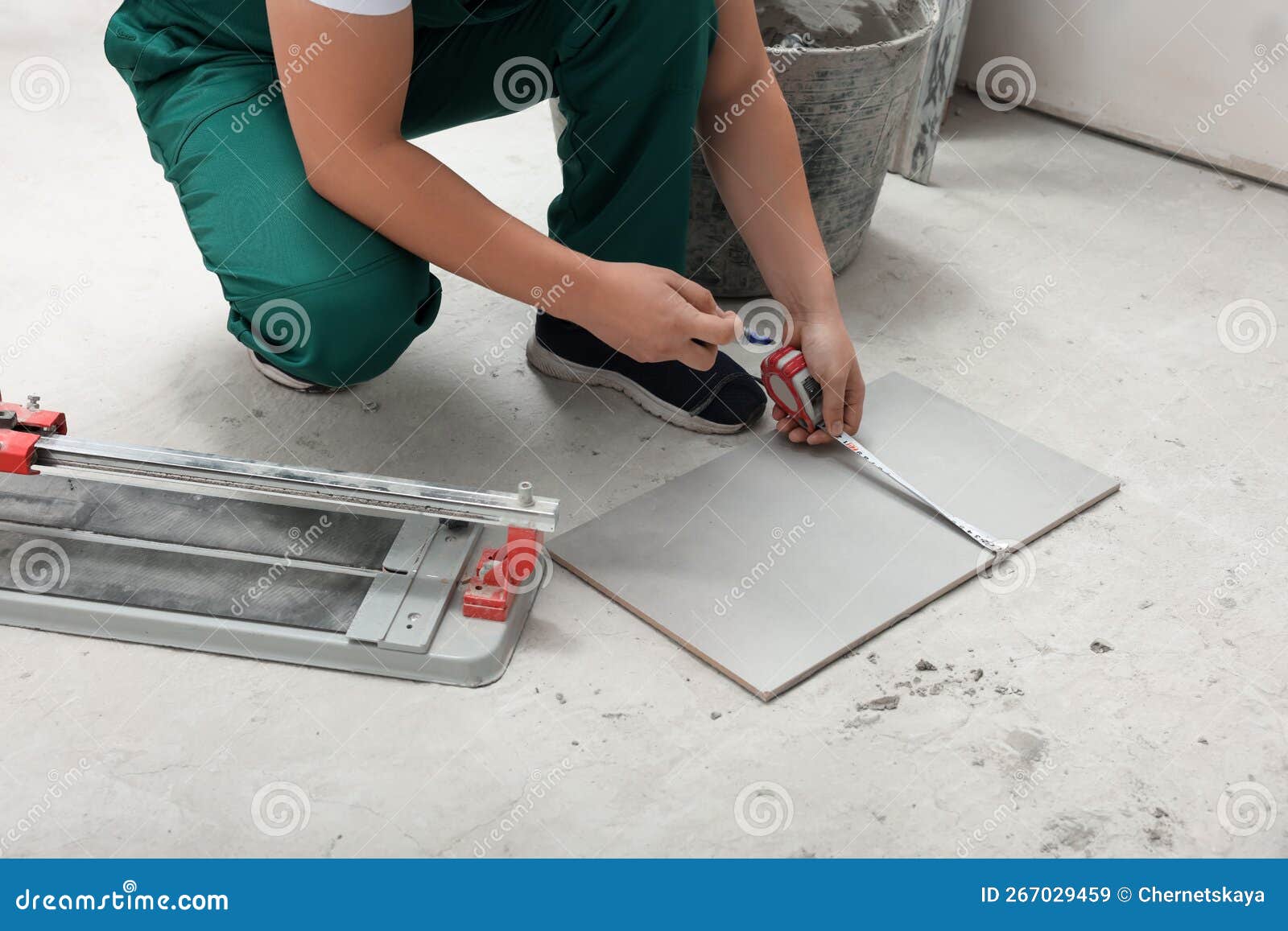 Worker Measuring Ceramic Tile on Floor, Closeup Stock Image - Image of ...
