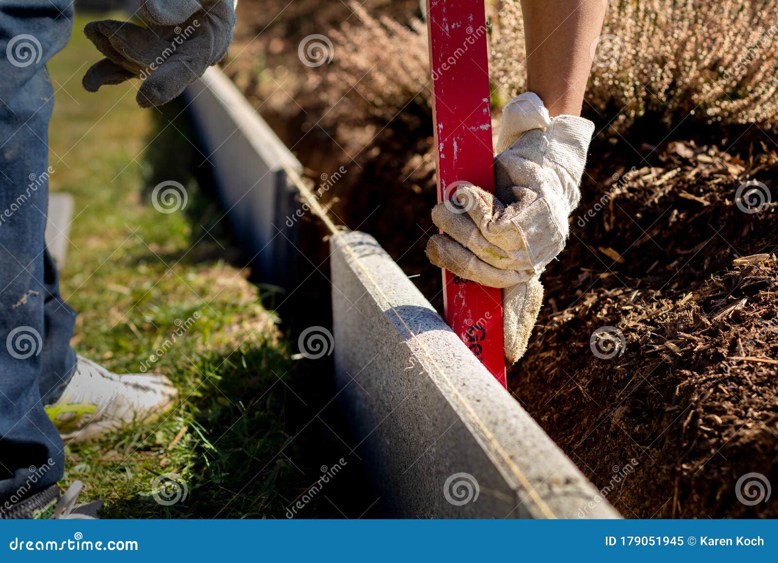Worker Measuring the Height of a Curb Stock Image - Image of border ...