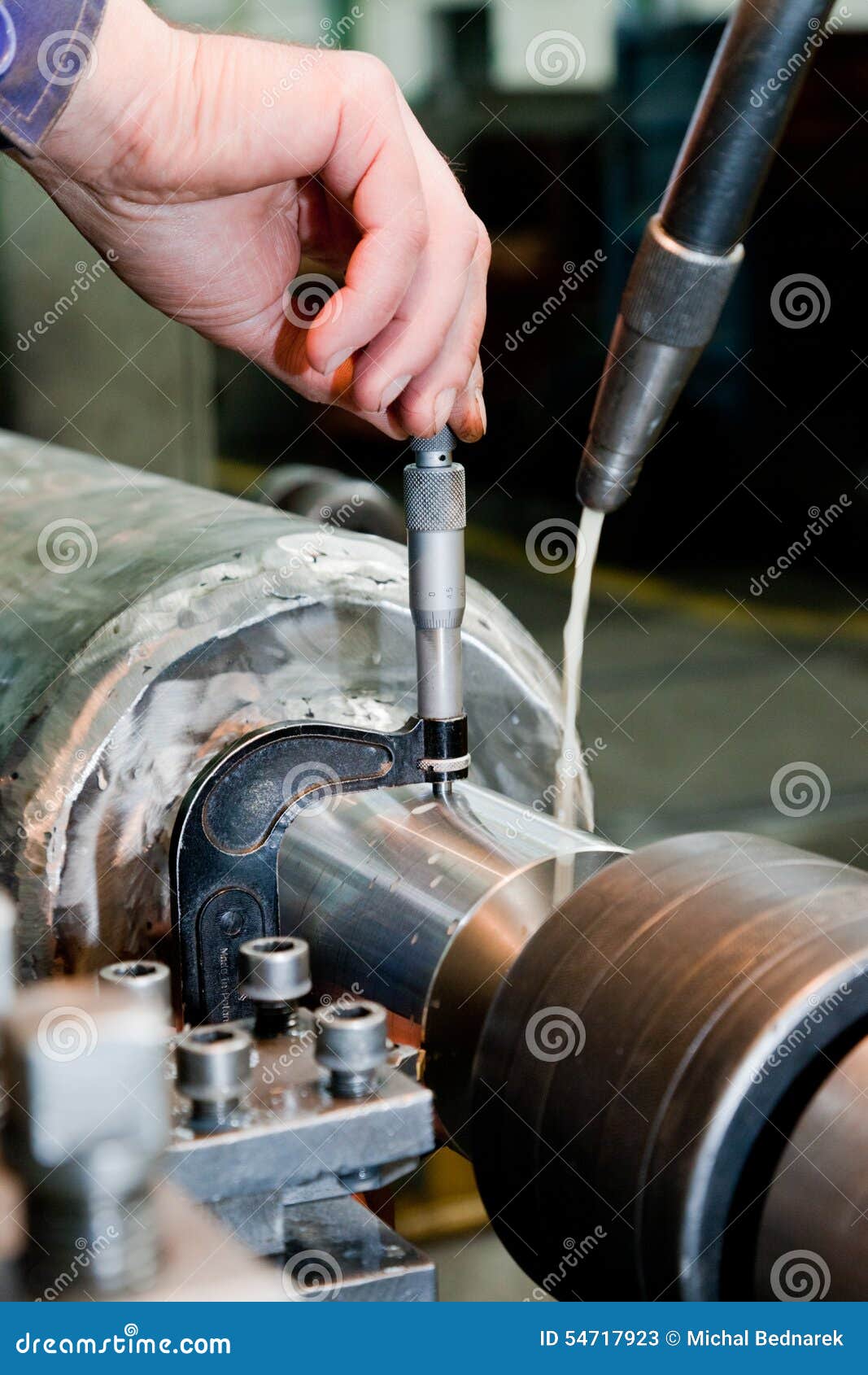 Worker Measuring on Industrial Turning Machine. Industry Stock Image ...