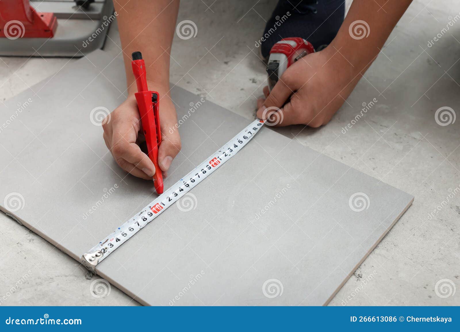 Worker Measuring and Marking Ceramic Tile on Floor, Closeup Stock Photo ...