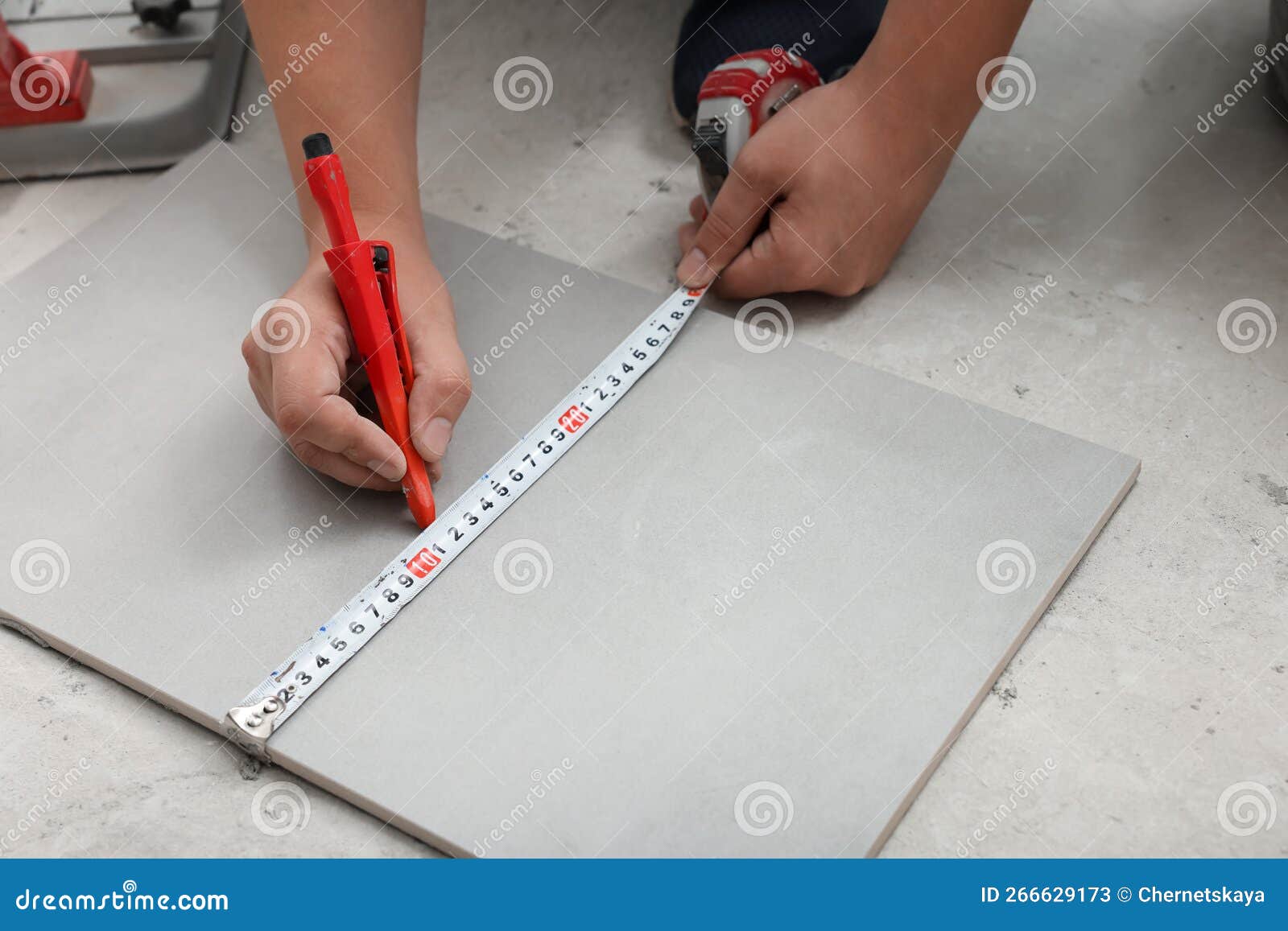 Worker Measuring and Marking Ceramic Tile on Floor, Closeup Stock Image ...