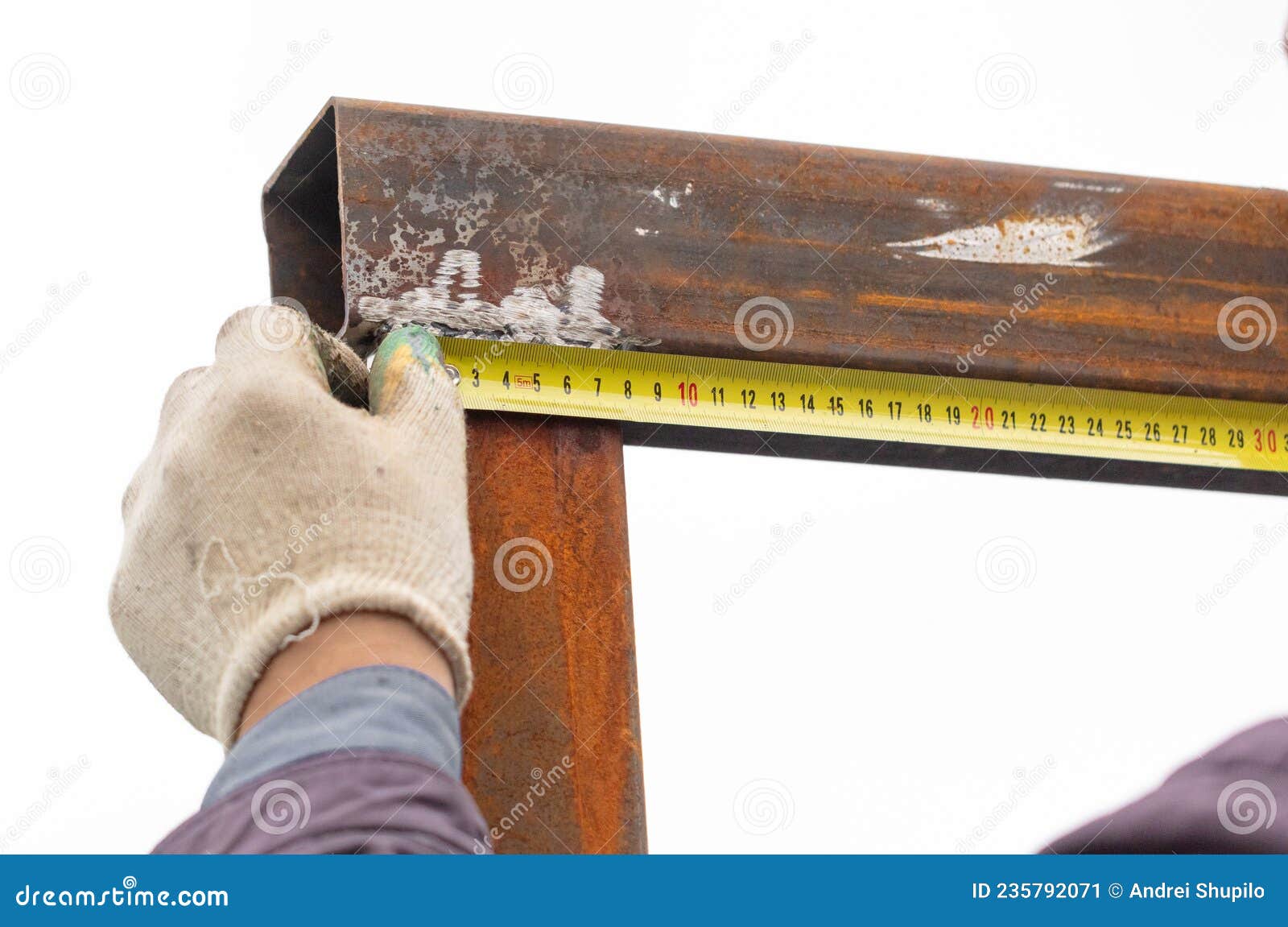 Worker Measuring Metal at a Construction Site. Stock Image - Image of ...