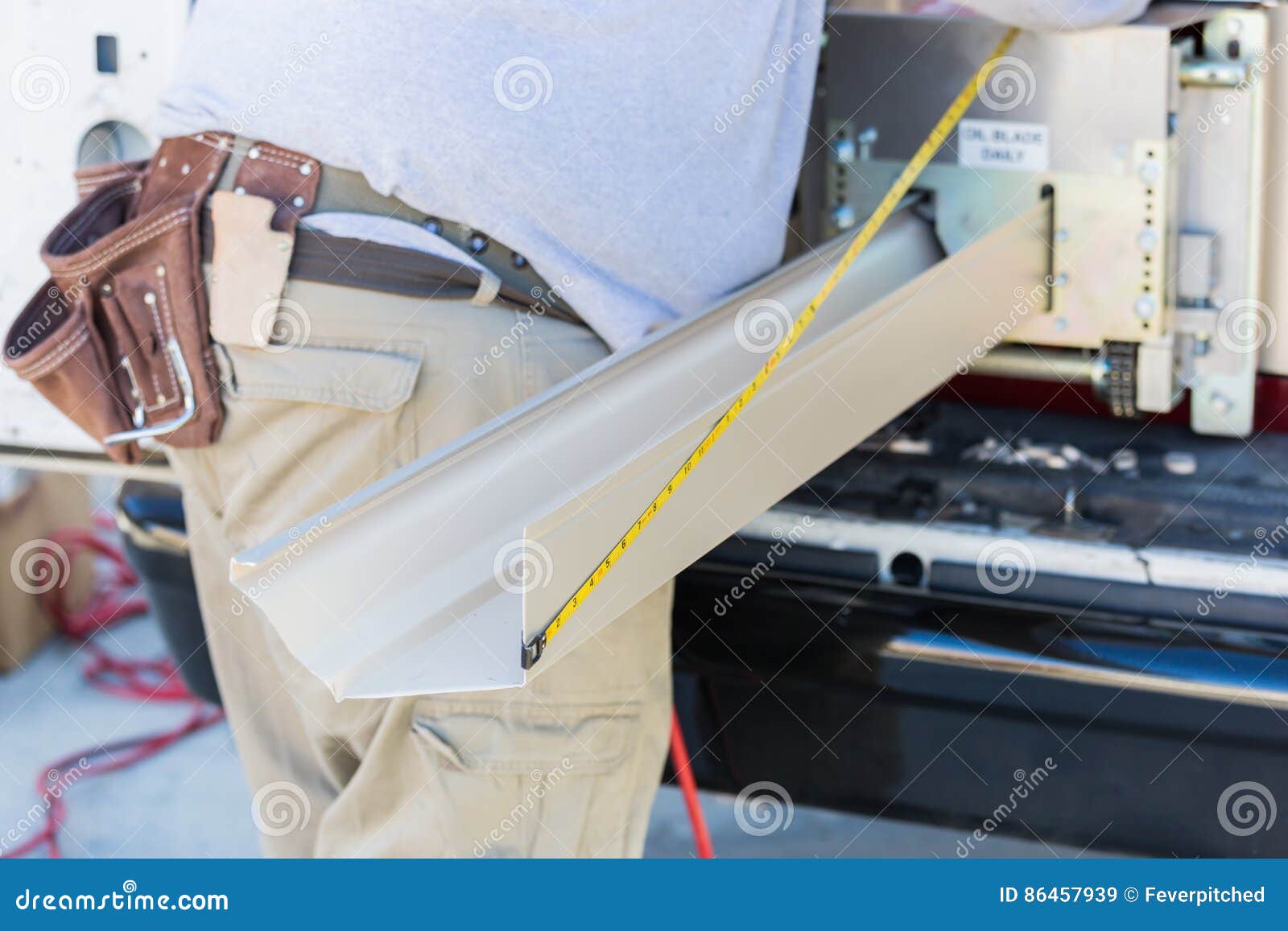 Worker Measuring Rain Gutter Processing through Seamless Shaping Stock ...