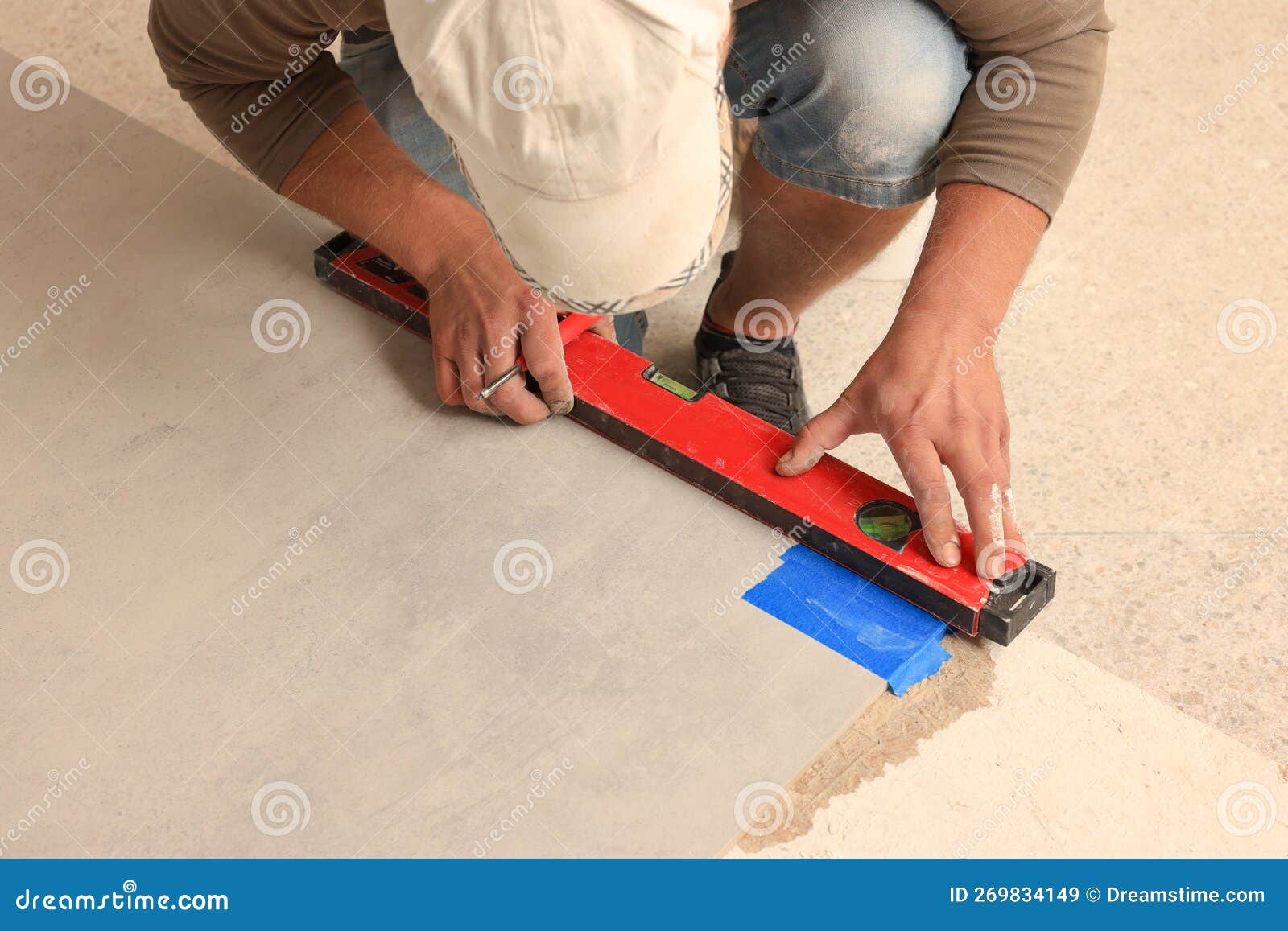 Worker Measuring Tile with Building Level Indoors Stock Image - Image ...