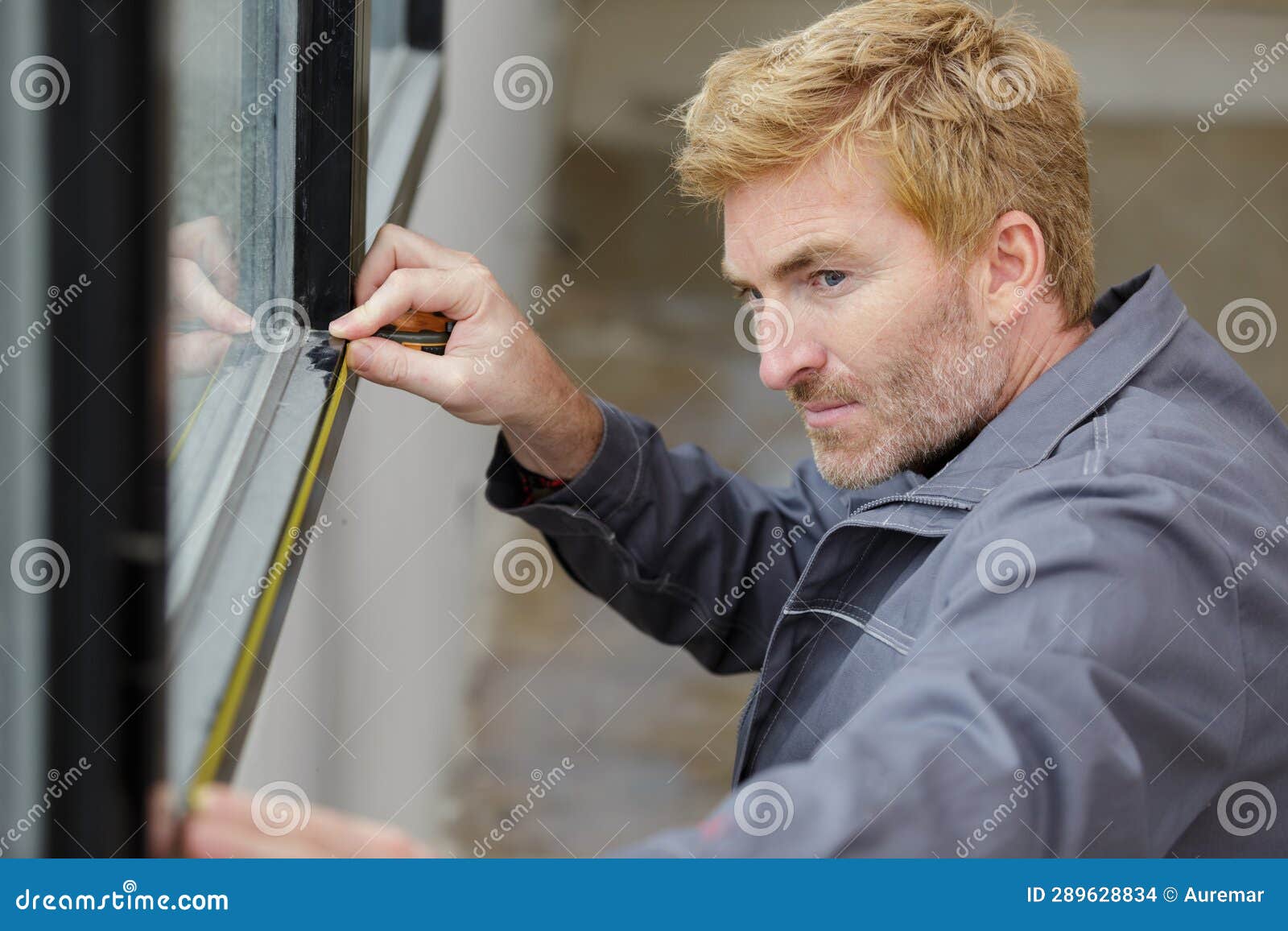 Worker Measuring Window at Construction Site Stock Photo - Image of ...