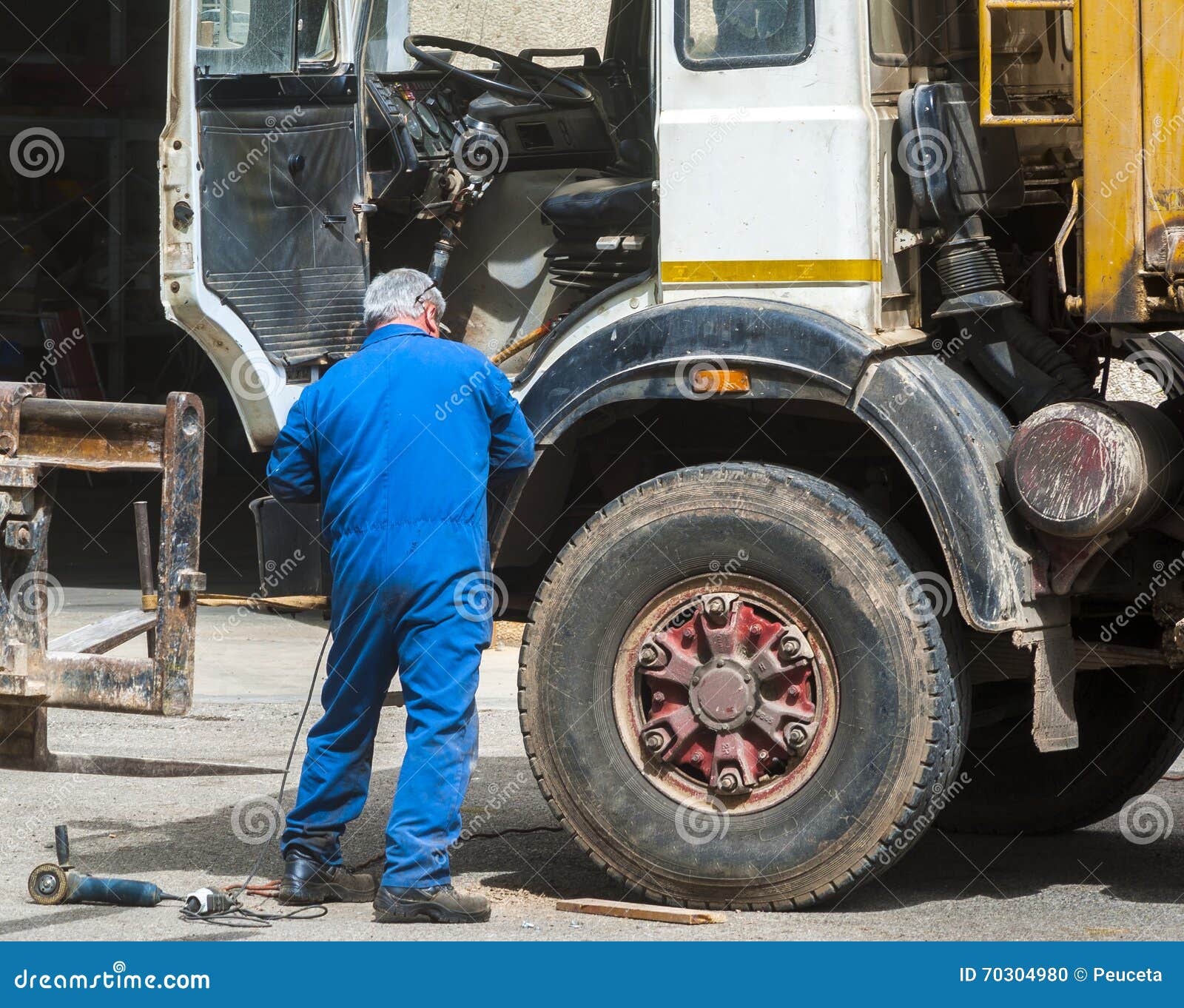 Worker Mechanical Repairing Trucks Stock Photo - Image of person ...
