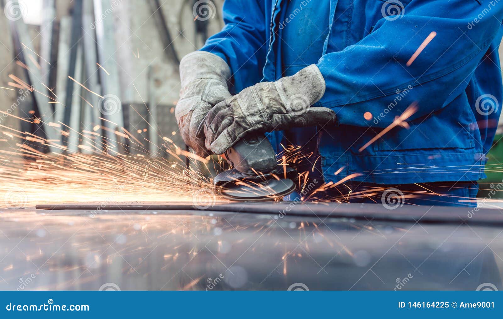 Worker in Metal Factory Grinding Workpiece with Sparks Flying Stock ...