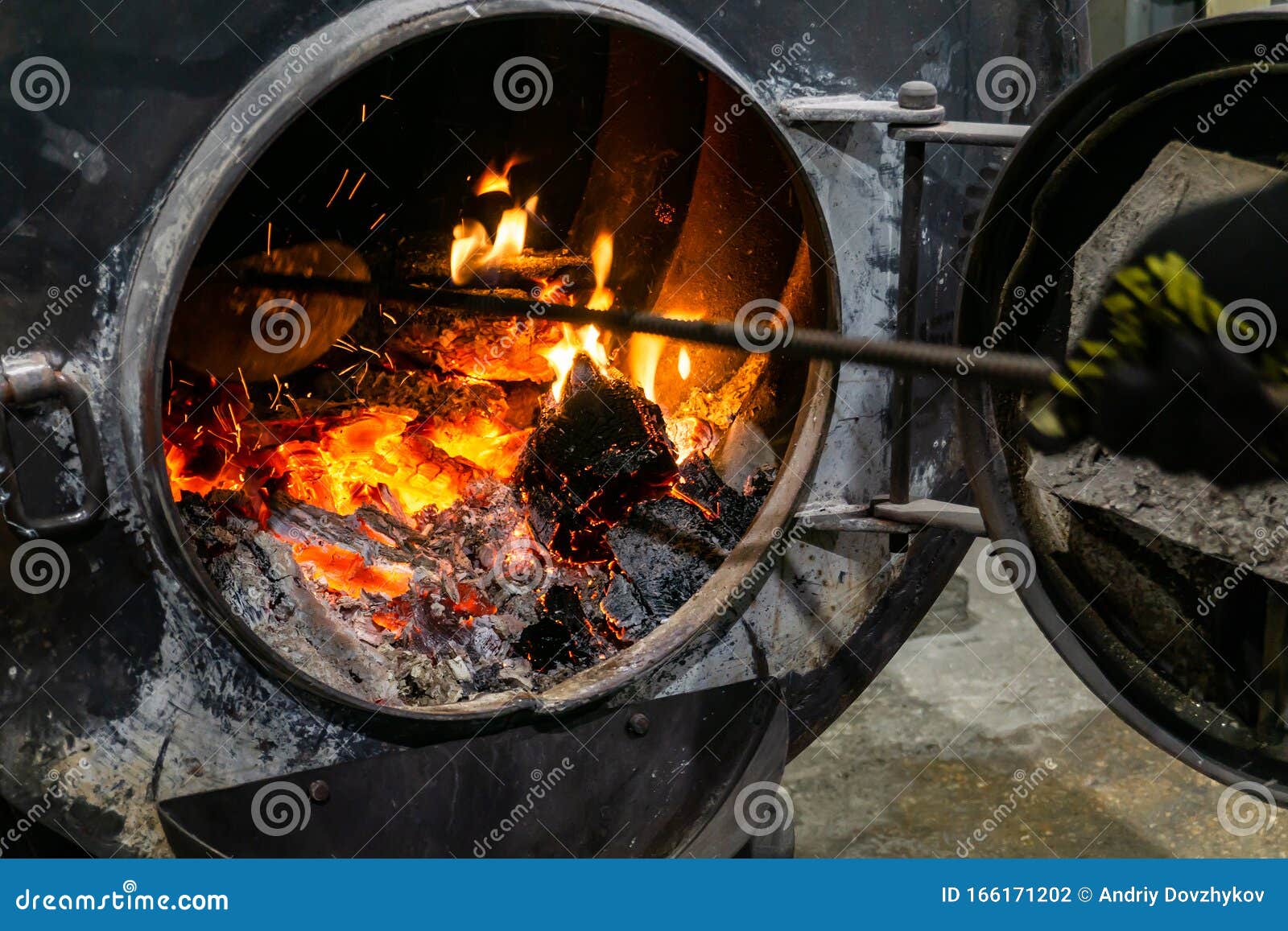Worker Mixes Burning Ash in a Furnace for Heating Stock Photo - Image ...