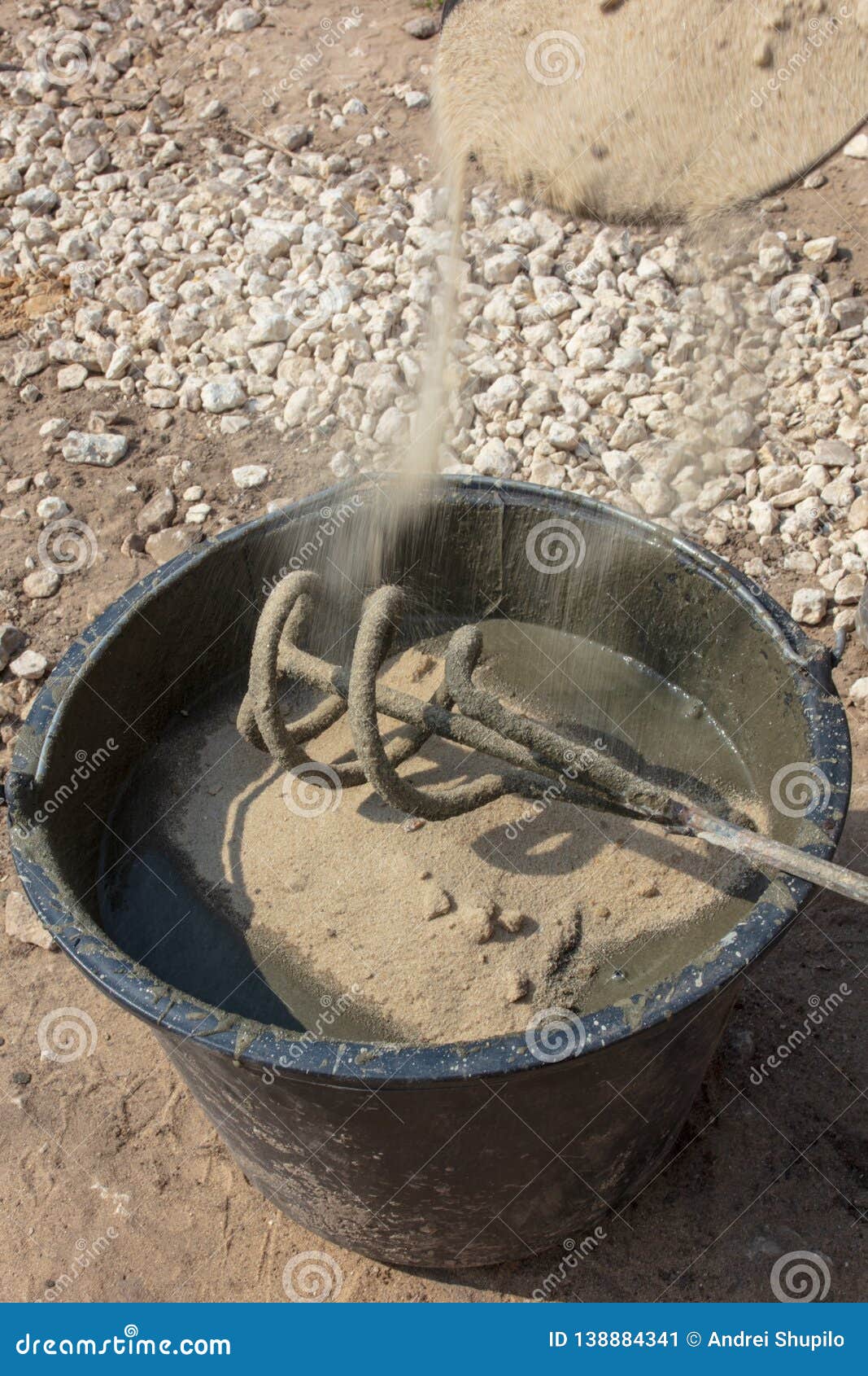 The Worker Mixes the Concrete Mixture at the Construction Site Stock ...