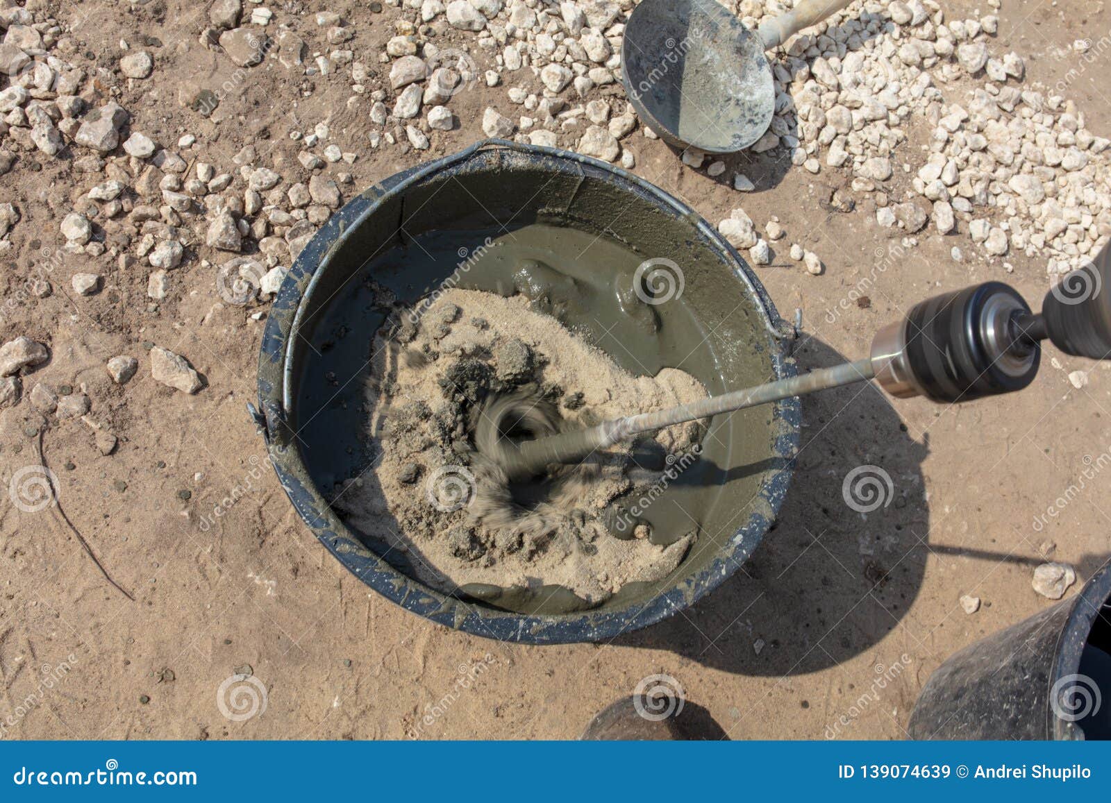 The Worker Mixes the Concrete Mixture at the Construction Site Stock ...