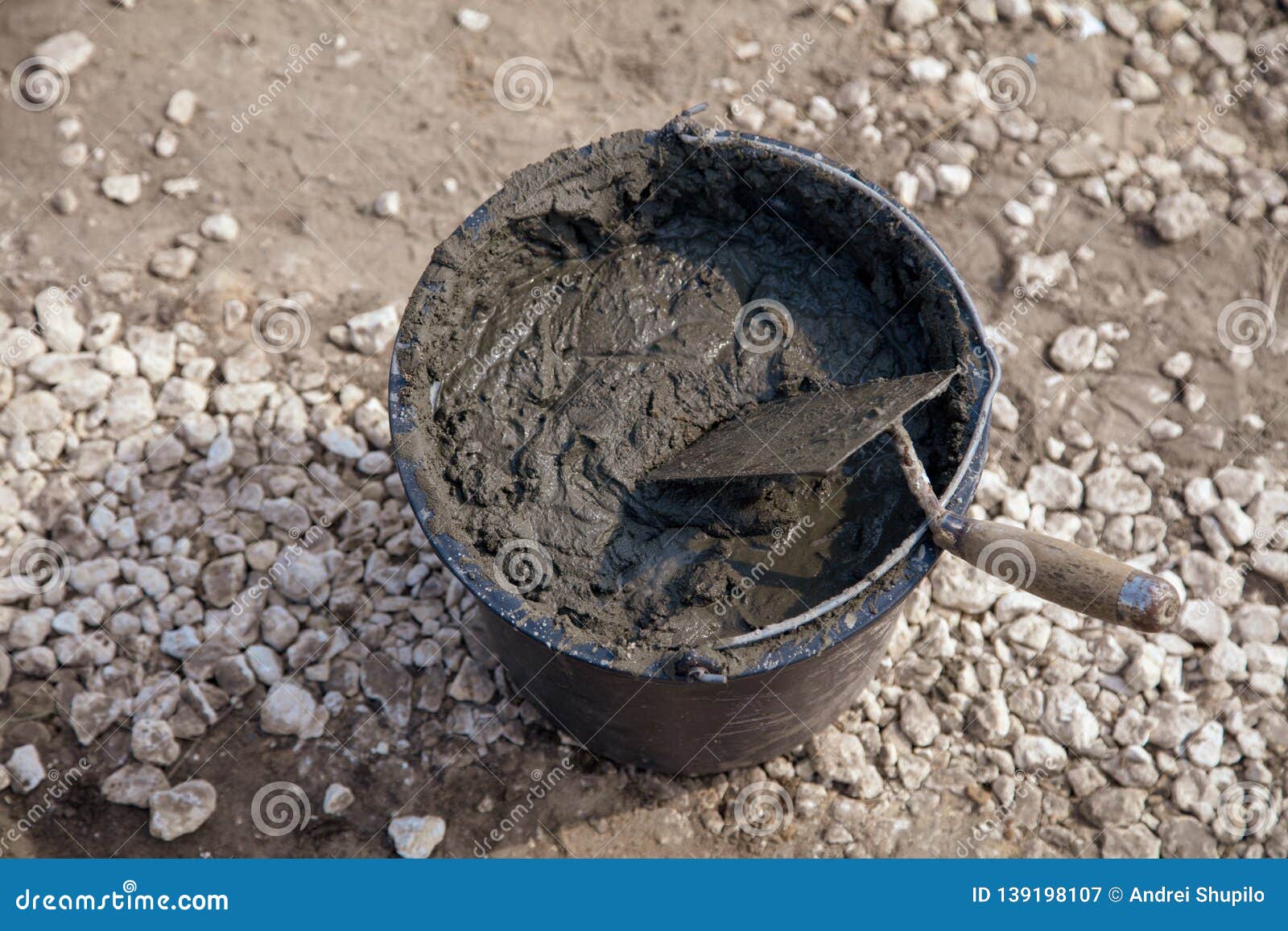 The Worker Mixes the Concrete Mixture at the Construction Site Stock ...