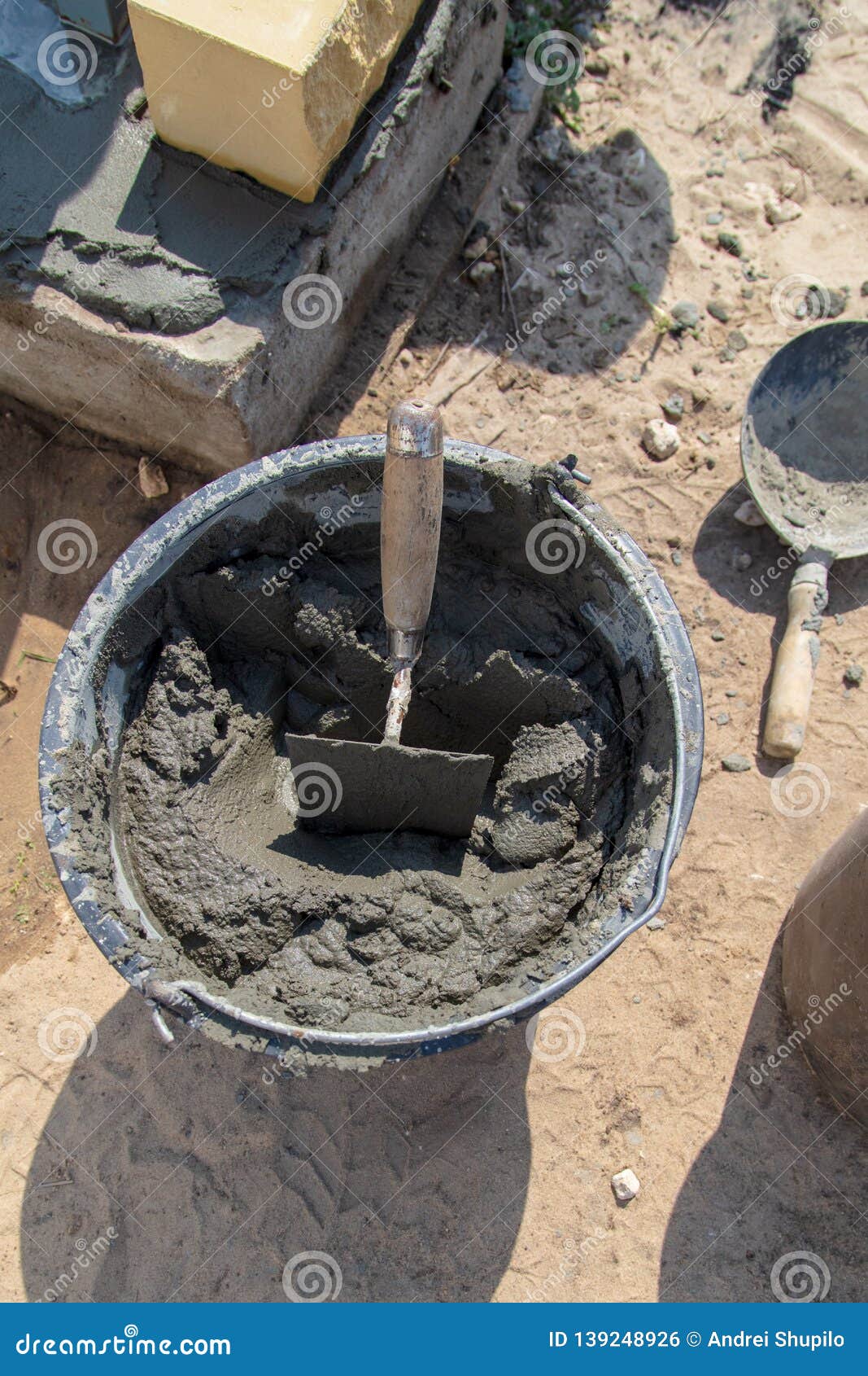 The Worker Mixes the Concrete Mixture at the Construction Site Stock ...