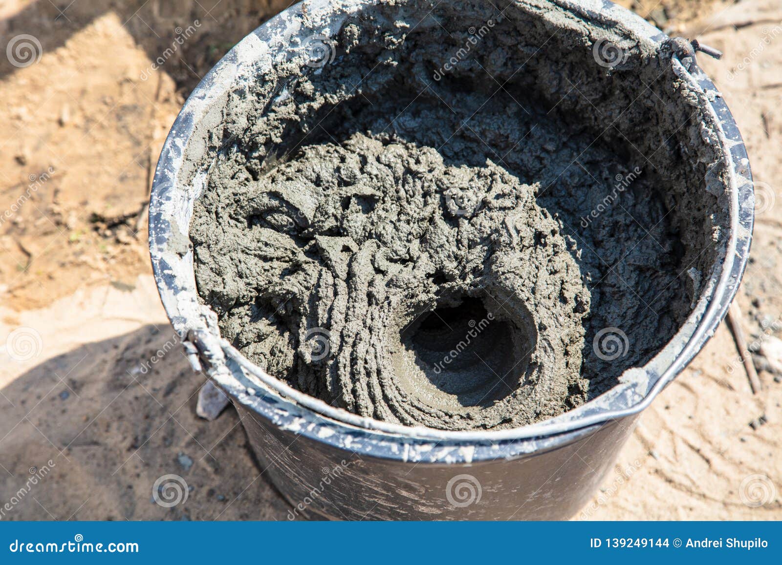 The Worker Mixes the Concrete Mixture at the Construction Site Stock ...
