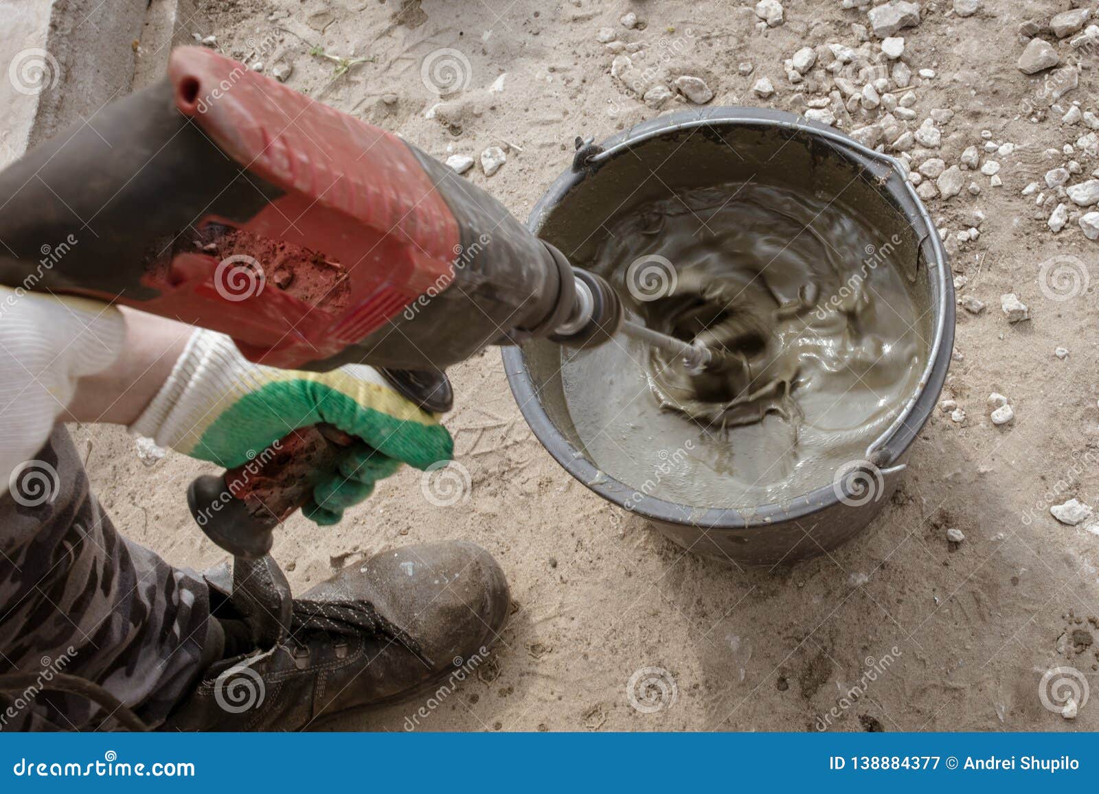 The Worker Mixes the Concrete Mixture at the Construction Site Stock ...