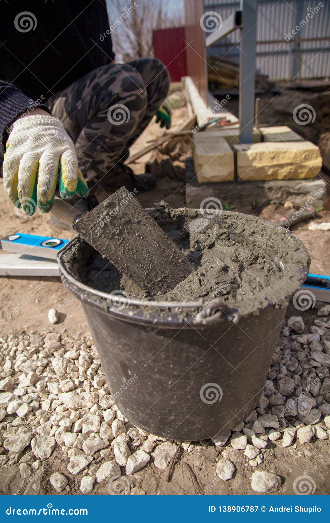 The Worker Mixes the Concrete Mixture at the Construction Site Stock ...