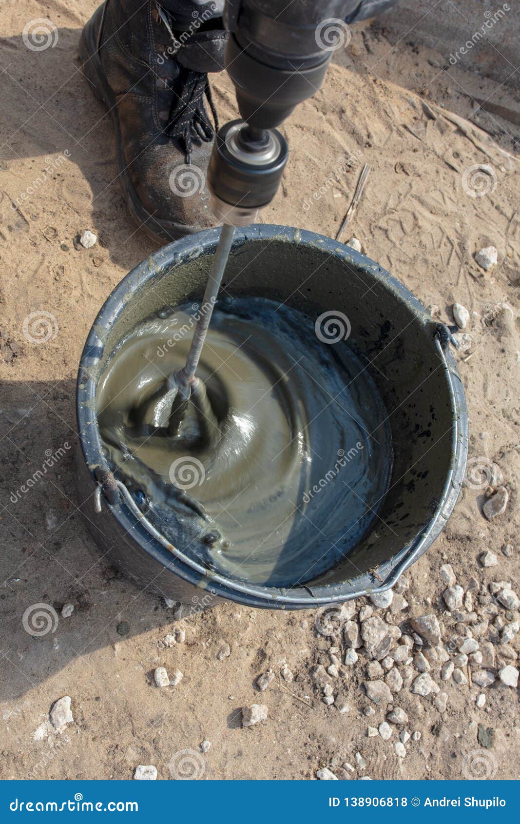 The Worker Mixes the Concrete Mixture at the Construction Site Stock ...