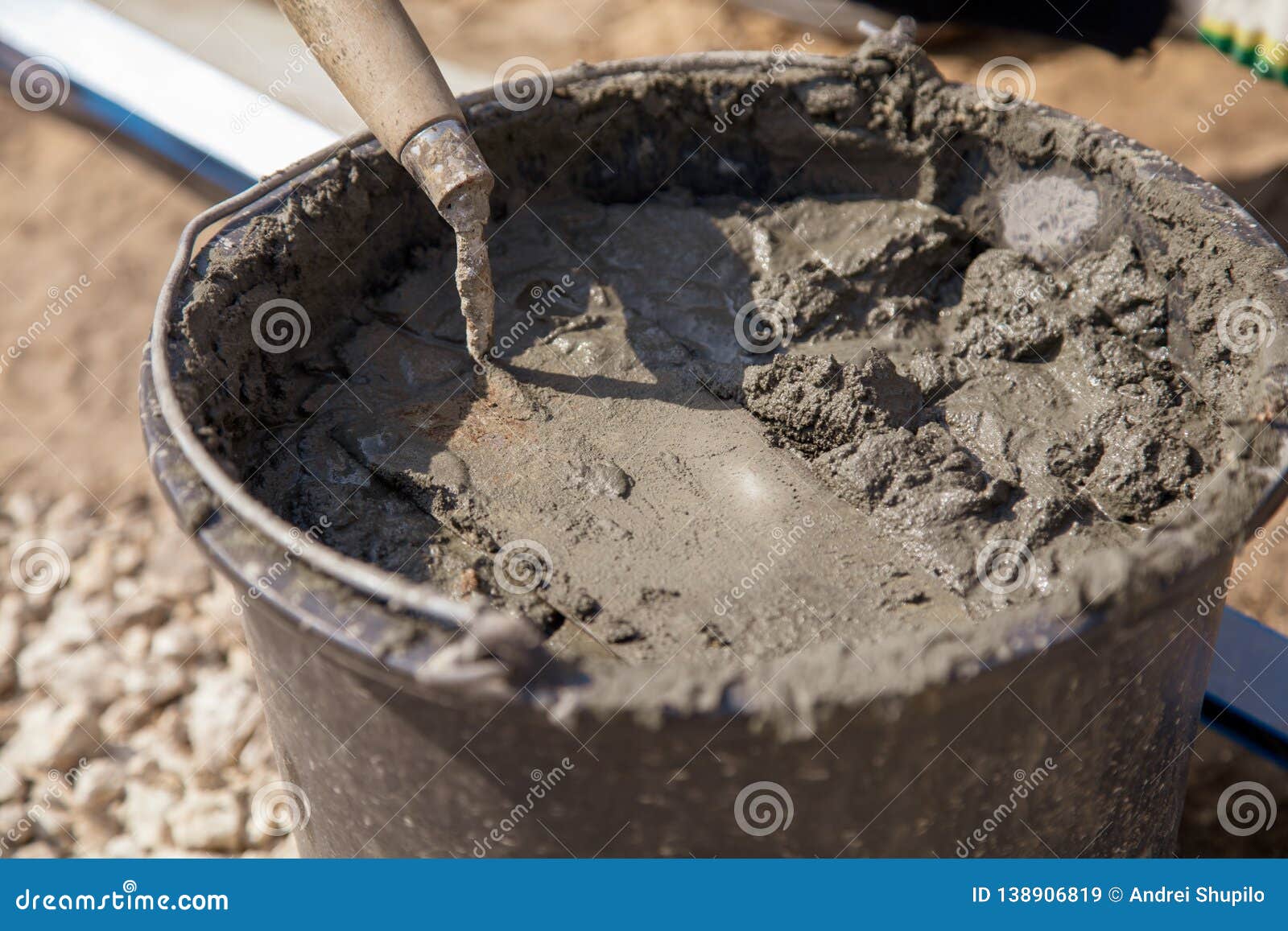 The Worker Mixes the Concrete Mixture at the Construction Site Stock ...