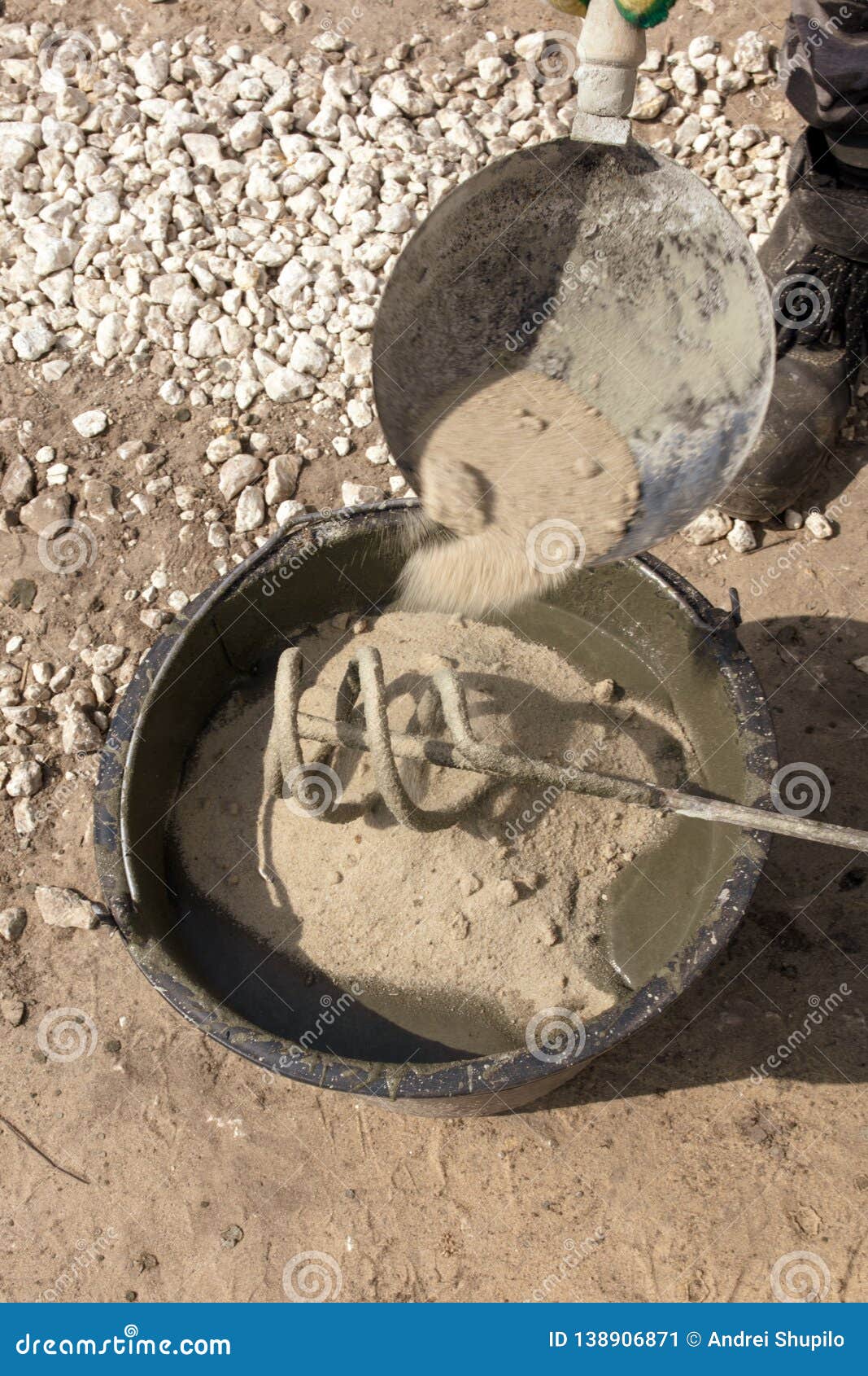 The Worker Mixes the Concrete Mixture at the Construction Site Stock ...