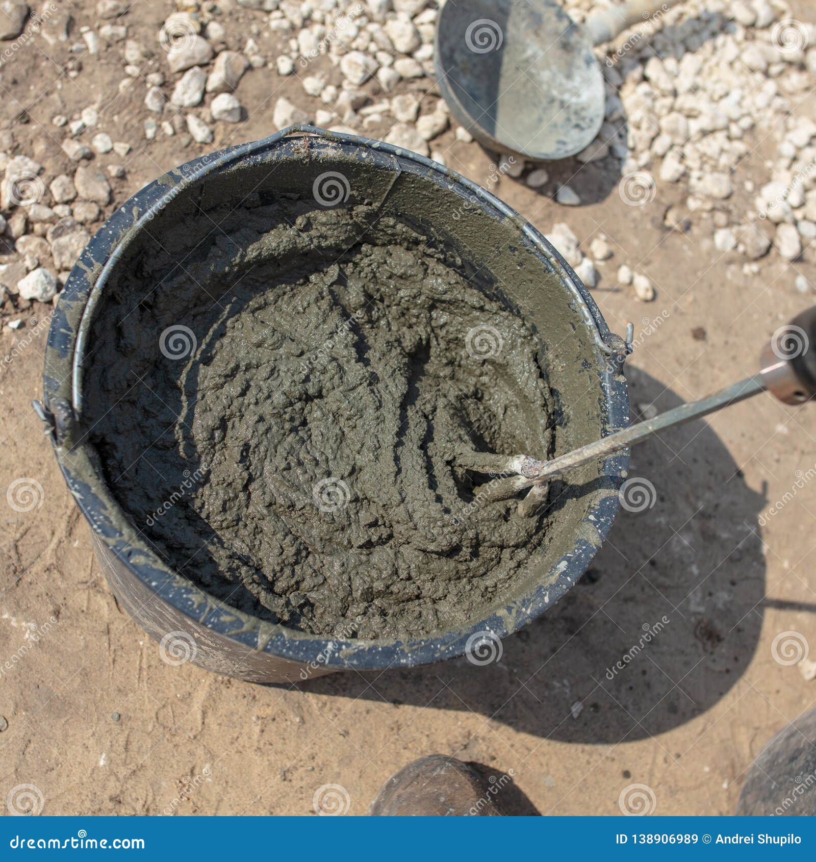 The Worker Mixes the Concrete Mixture at the Construction Site Stock ...