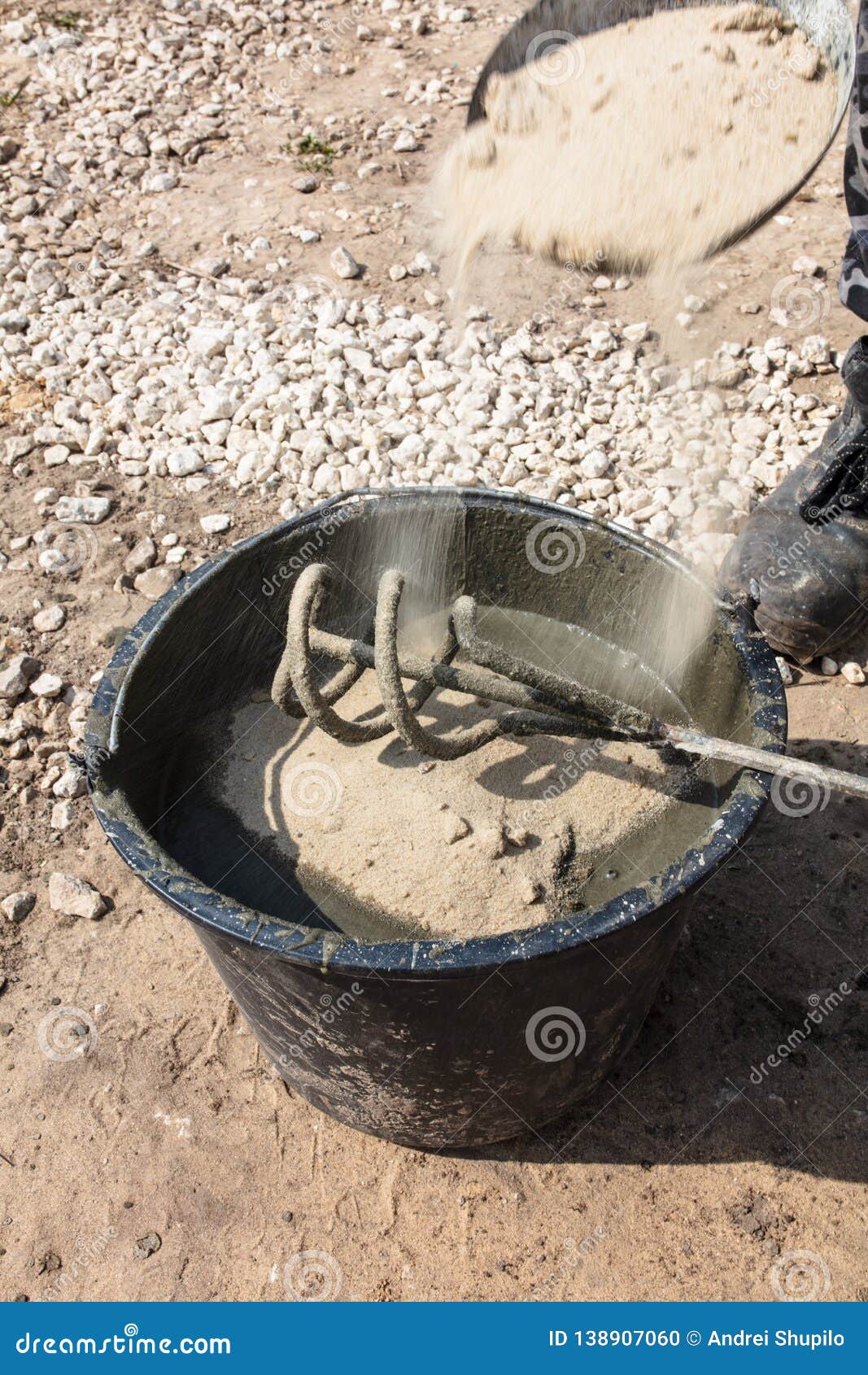 The Worker Mixes the Concrete Mixture at the Construction Site Stock ...