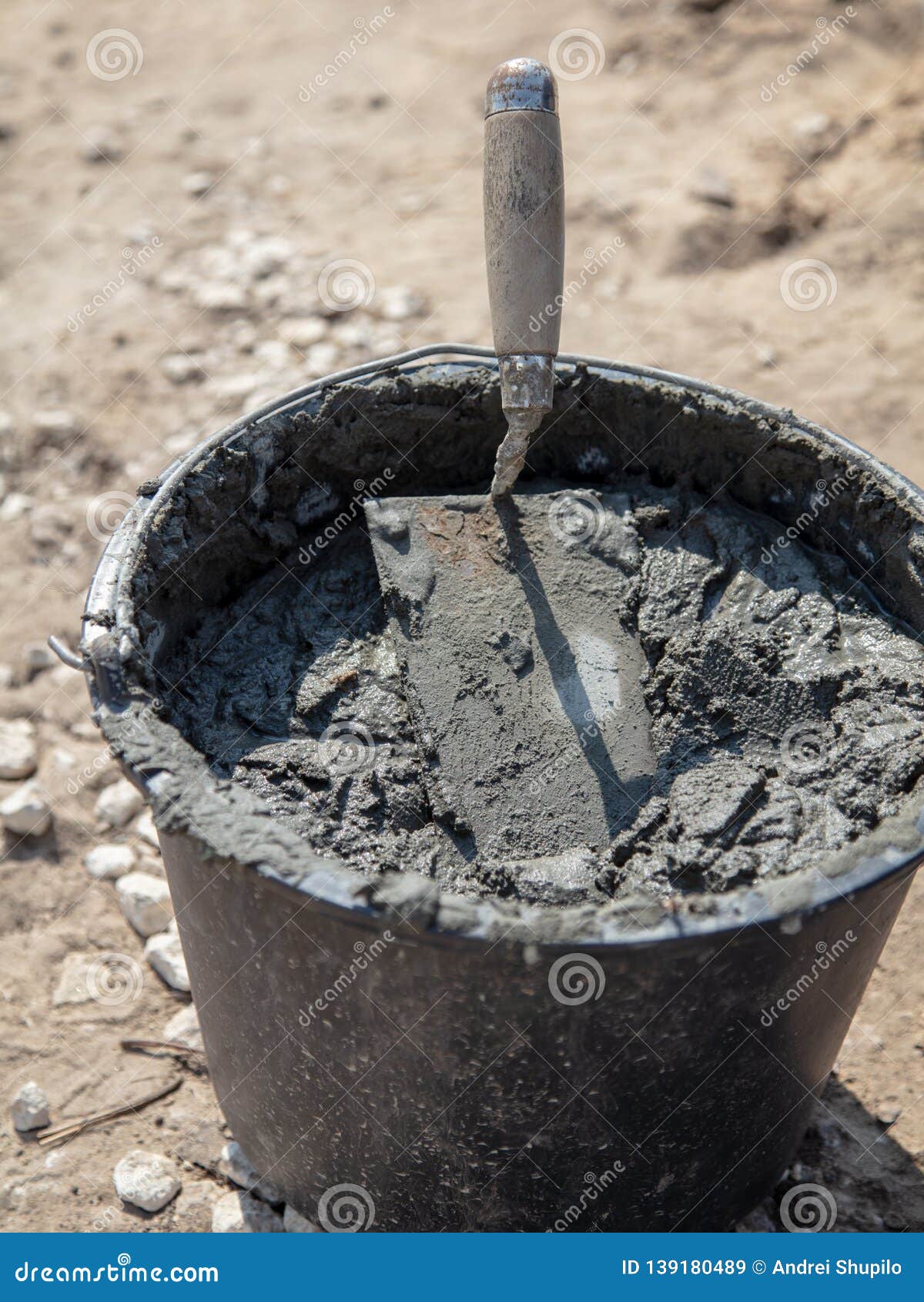 The Worker Mixes the Concrete Mixture at the Construction Site Stock ...