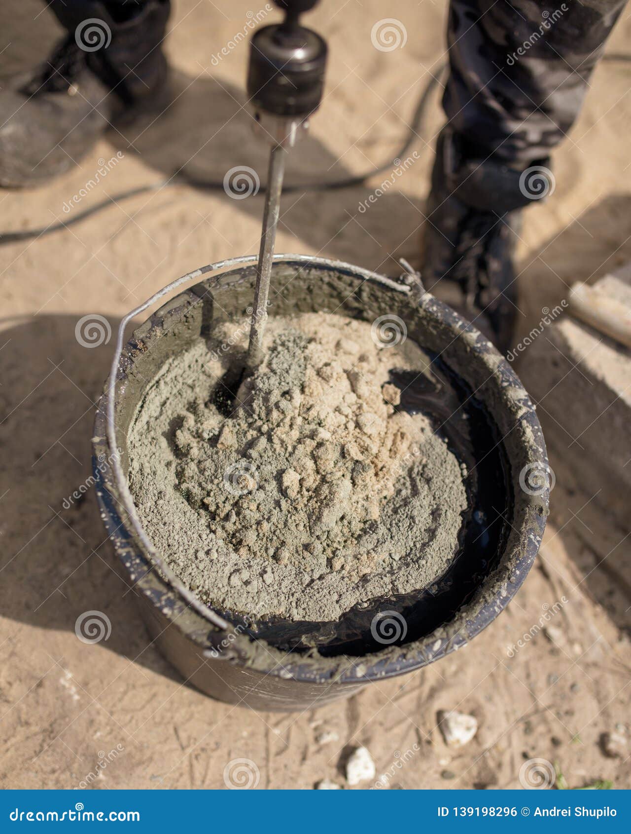 The Worker Mixes the Concrete Mixture at the Construction Site Stock ...