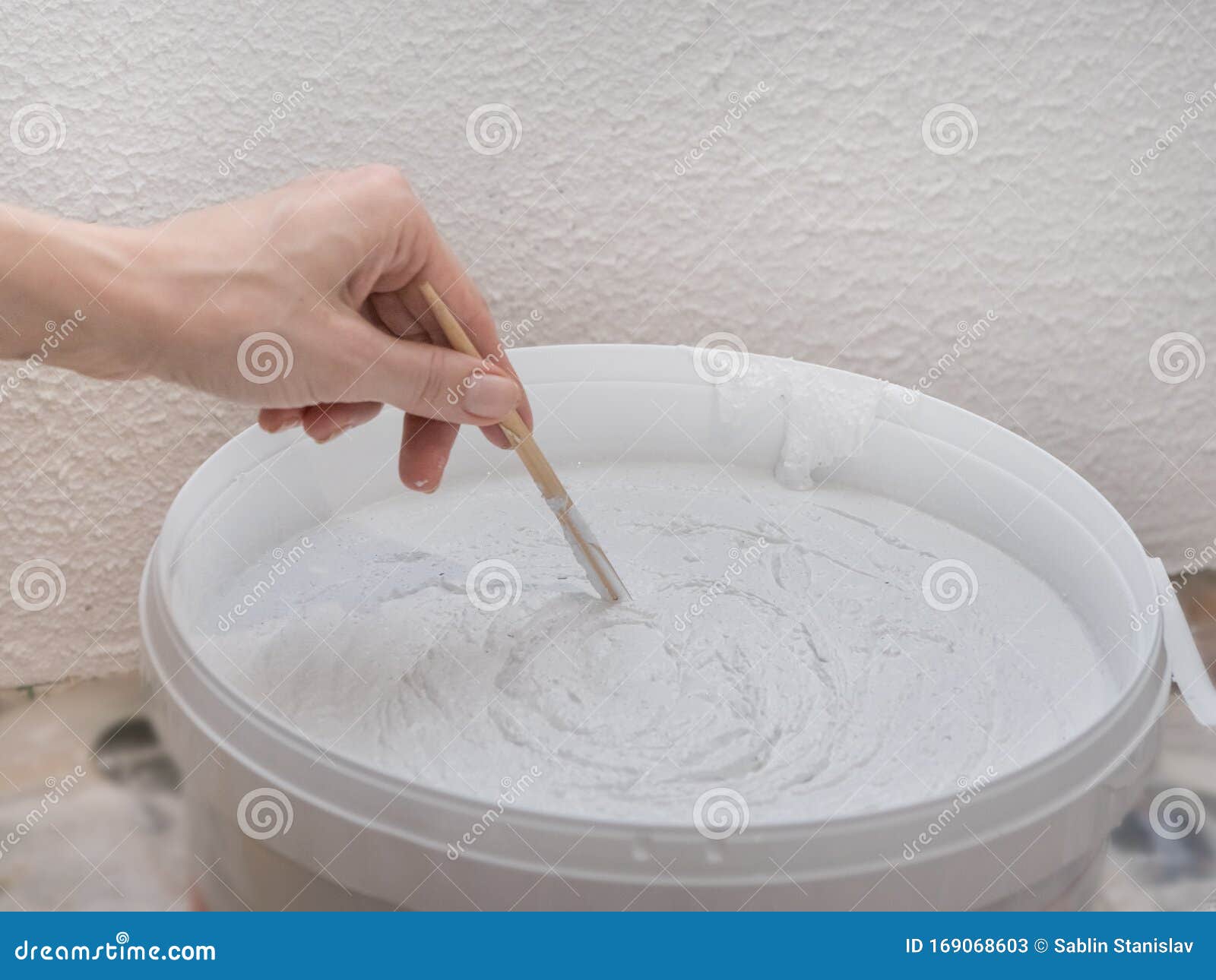 Worker Mixes Construction Putty in a Bucket. Stock Image - Image of ...