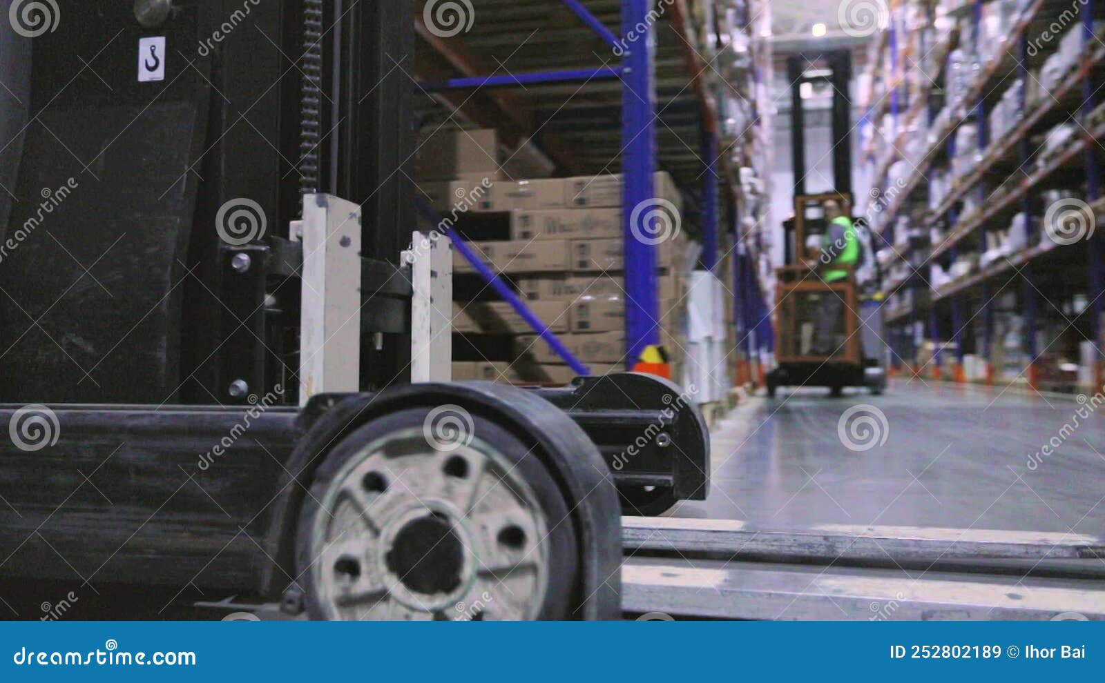 Workflow in a Modern Warehouse. Worker on a Modern Forklift. Working in ...