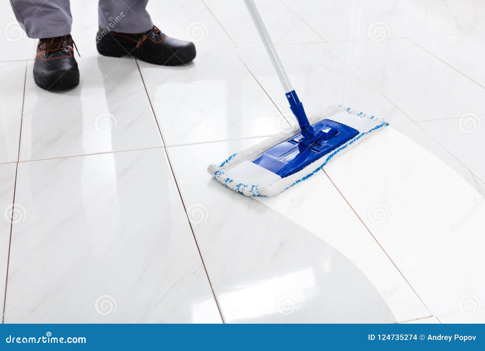 Worker Mopping Floor stock photo. Image of handsome - 124735274