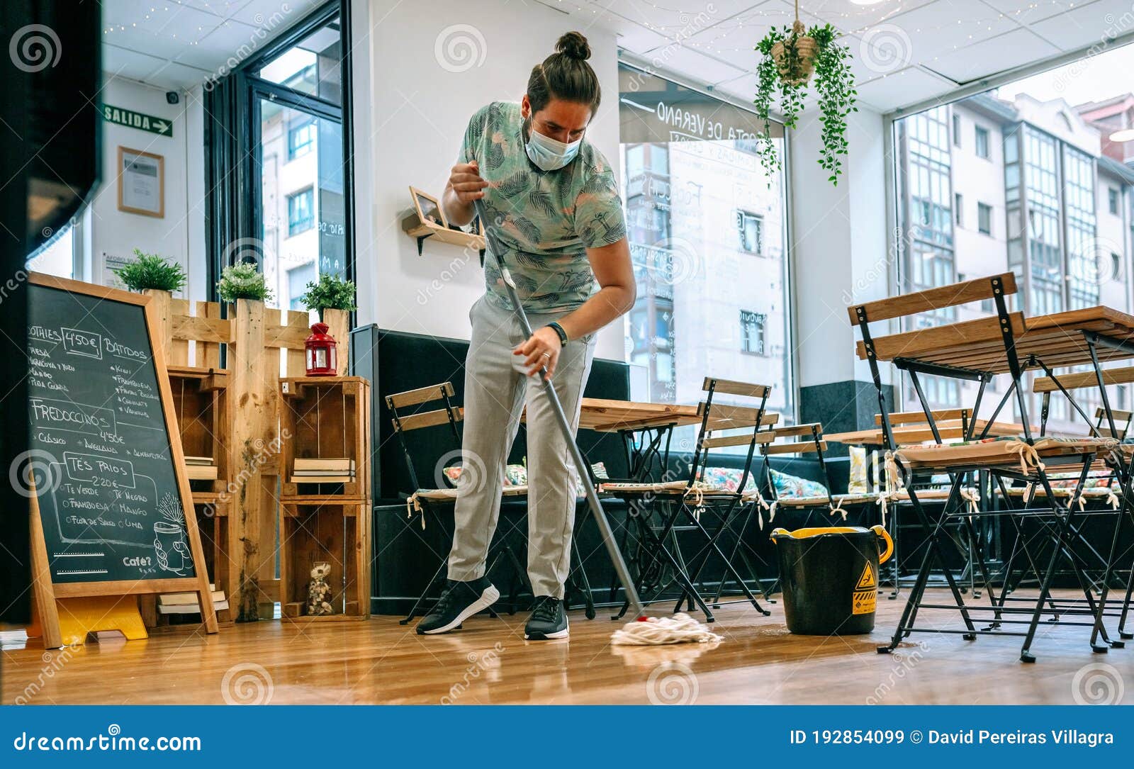 Worker Mopping the Floor of a Restaurant Stock Image - Image of ...