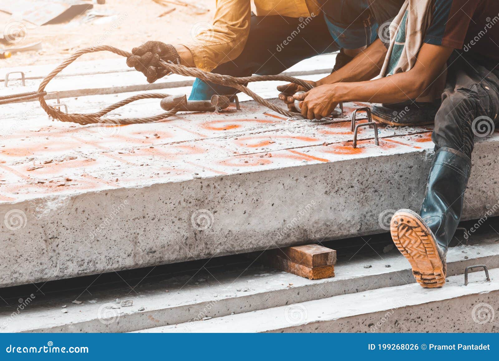 Worker Move Pile Concrete Pillars on Ground by Sling in Construction ...