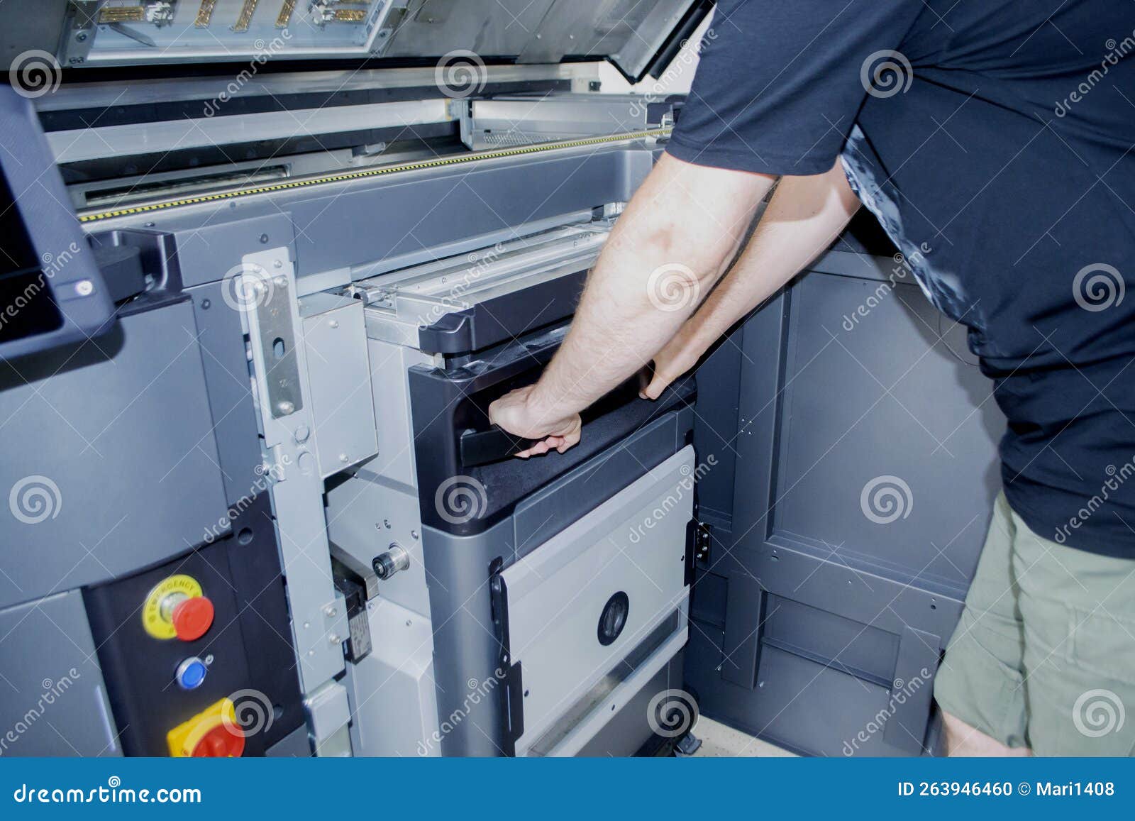 Worker Moves Working Camera of 3D Printer into 3D Printer. Industrial ...