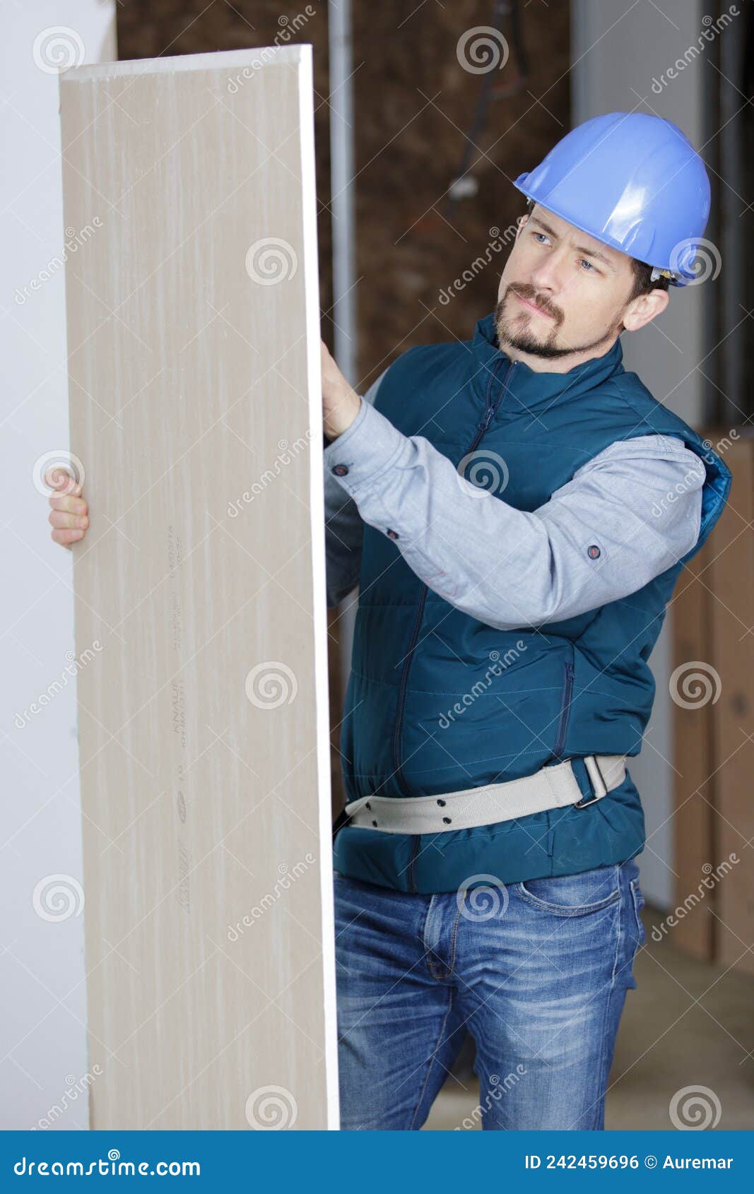 Worker Moving Boards within Residential Construction Site Stock Photo ...