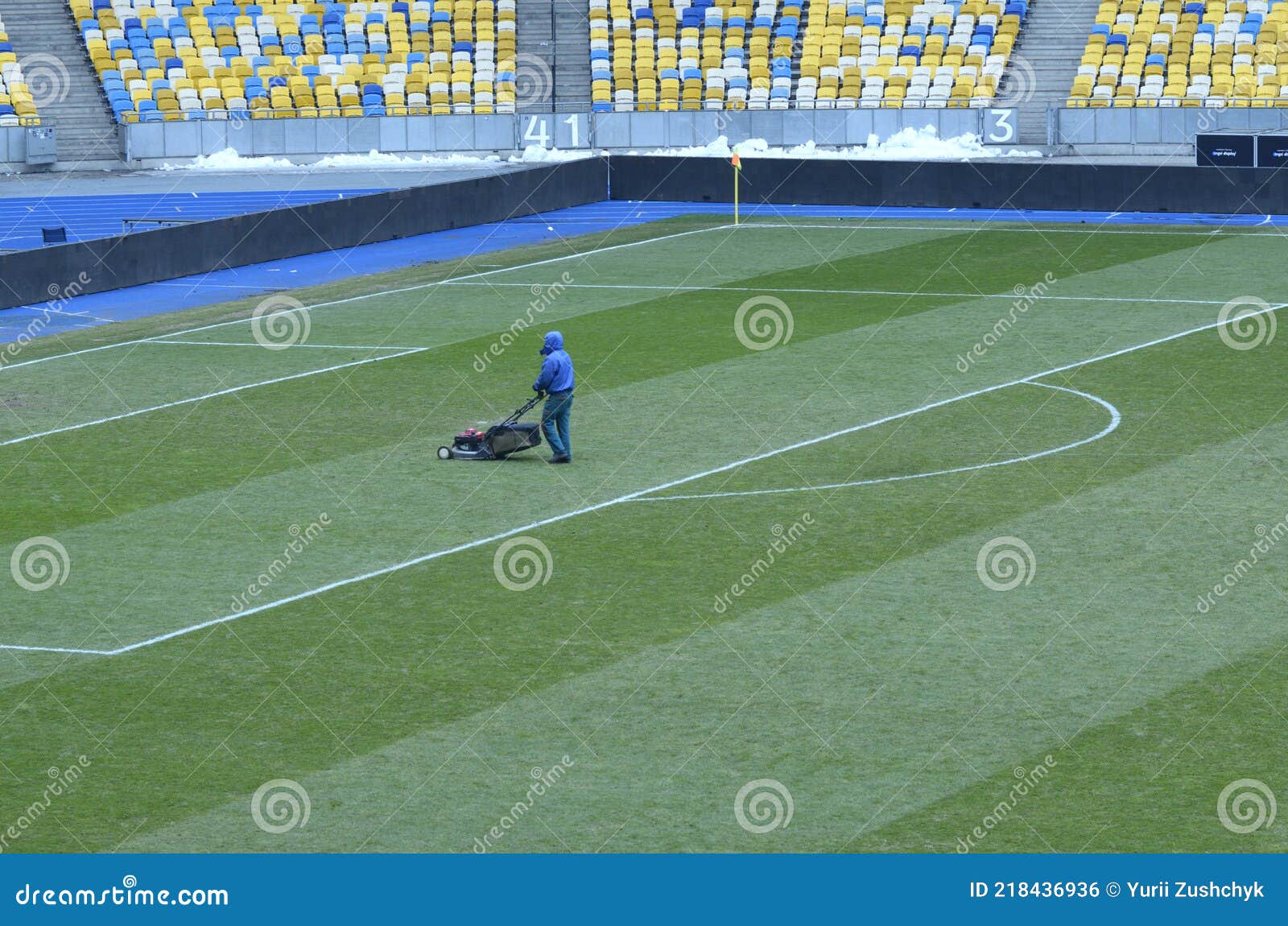 Worker Mowing Lawn on Football Field Using Grass-cutter Stock Photo ...