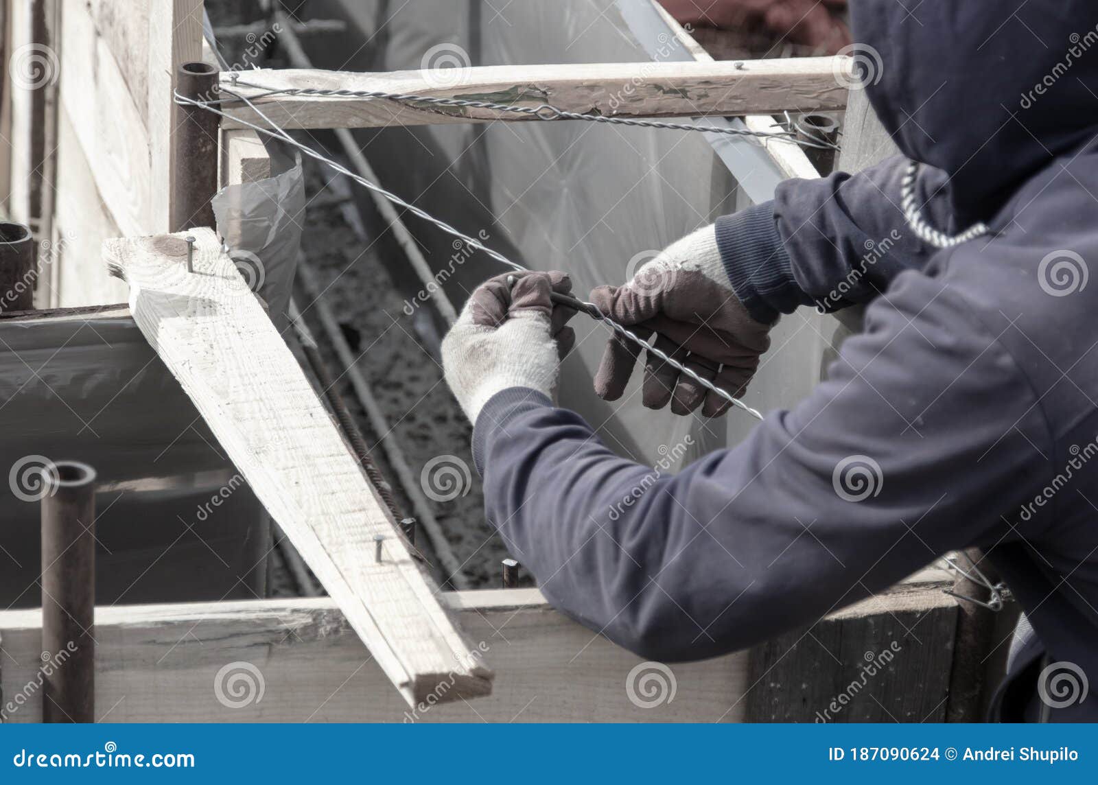 Worker Nails a Wire at a Construction Site at Home Stock Photo - Image ...