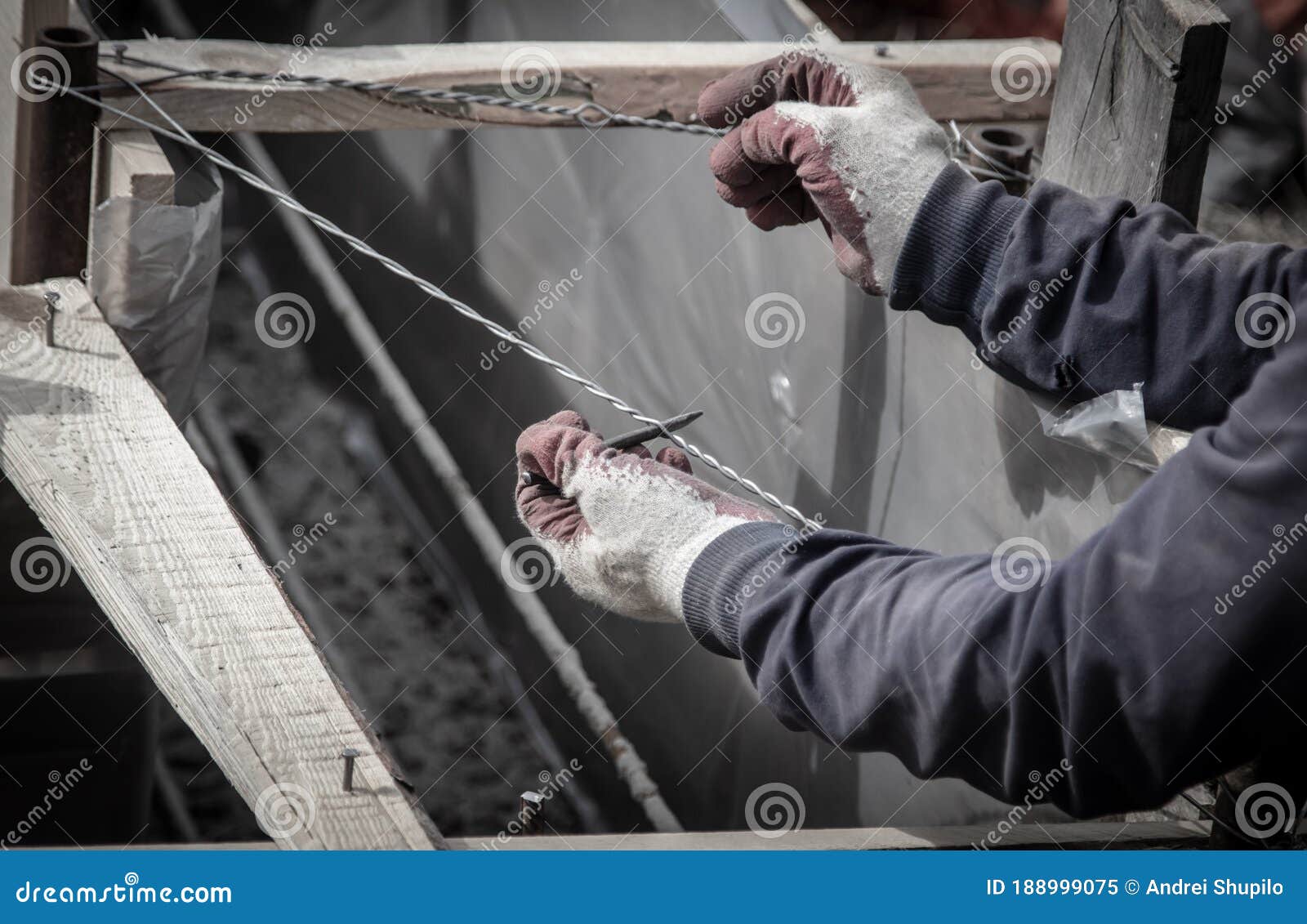 Worker Nails a Wire at a Construction Site at Home Stock Image - Image ...