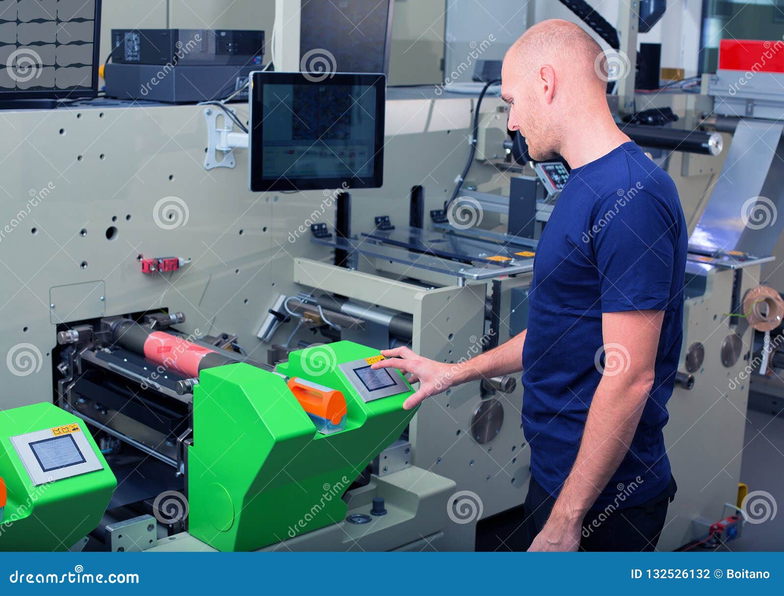 Worker Next To the Printing Machine Inputs the Data by Pressing the ...