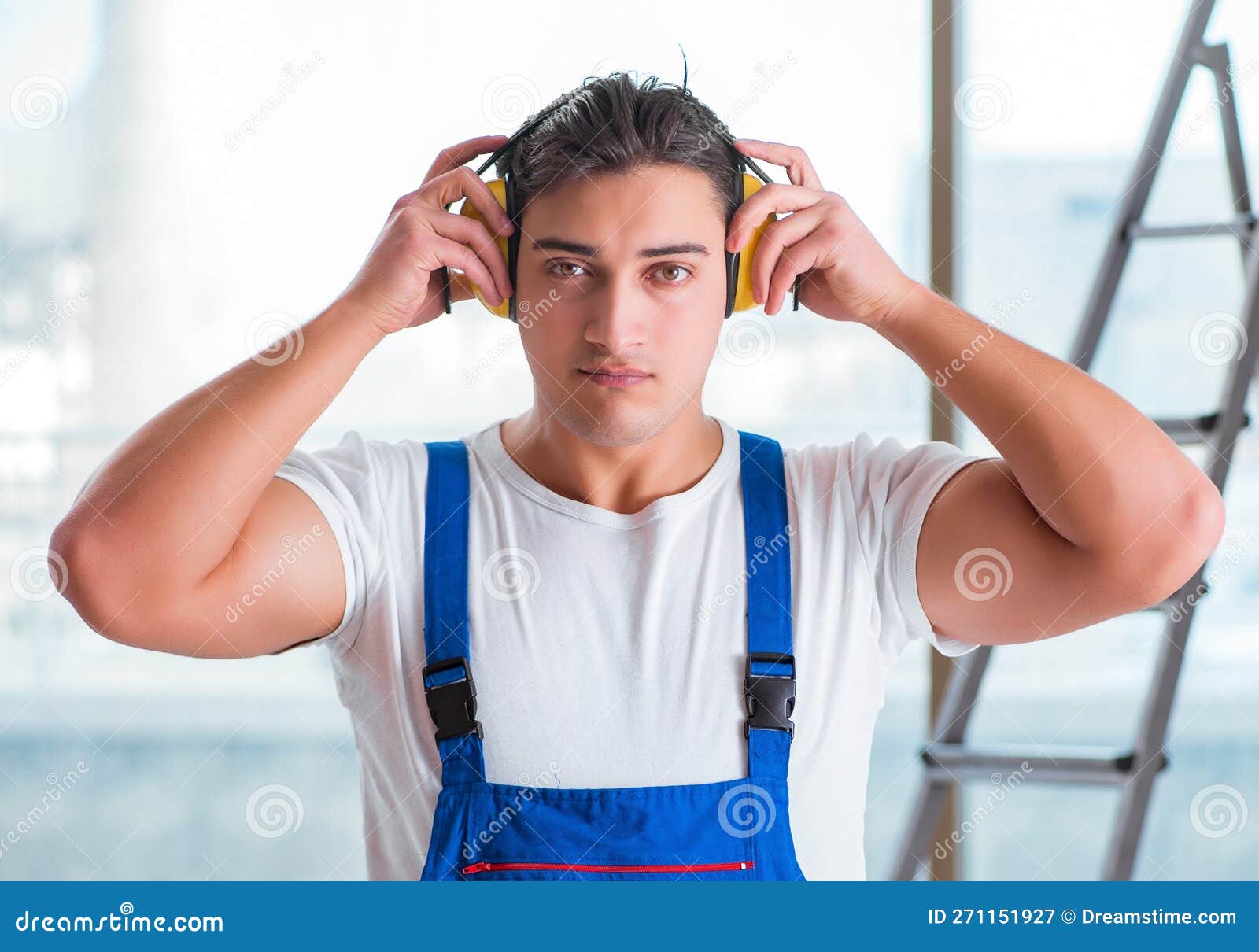 Worker with Noise Cancelling Headphones Stock Image - Image of earmuffs ...