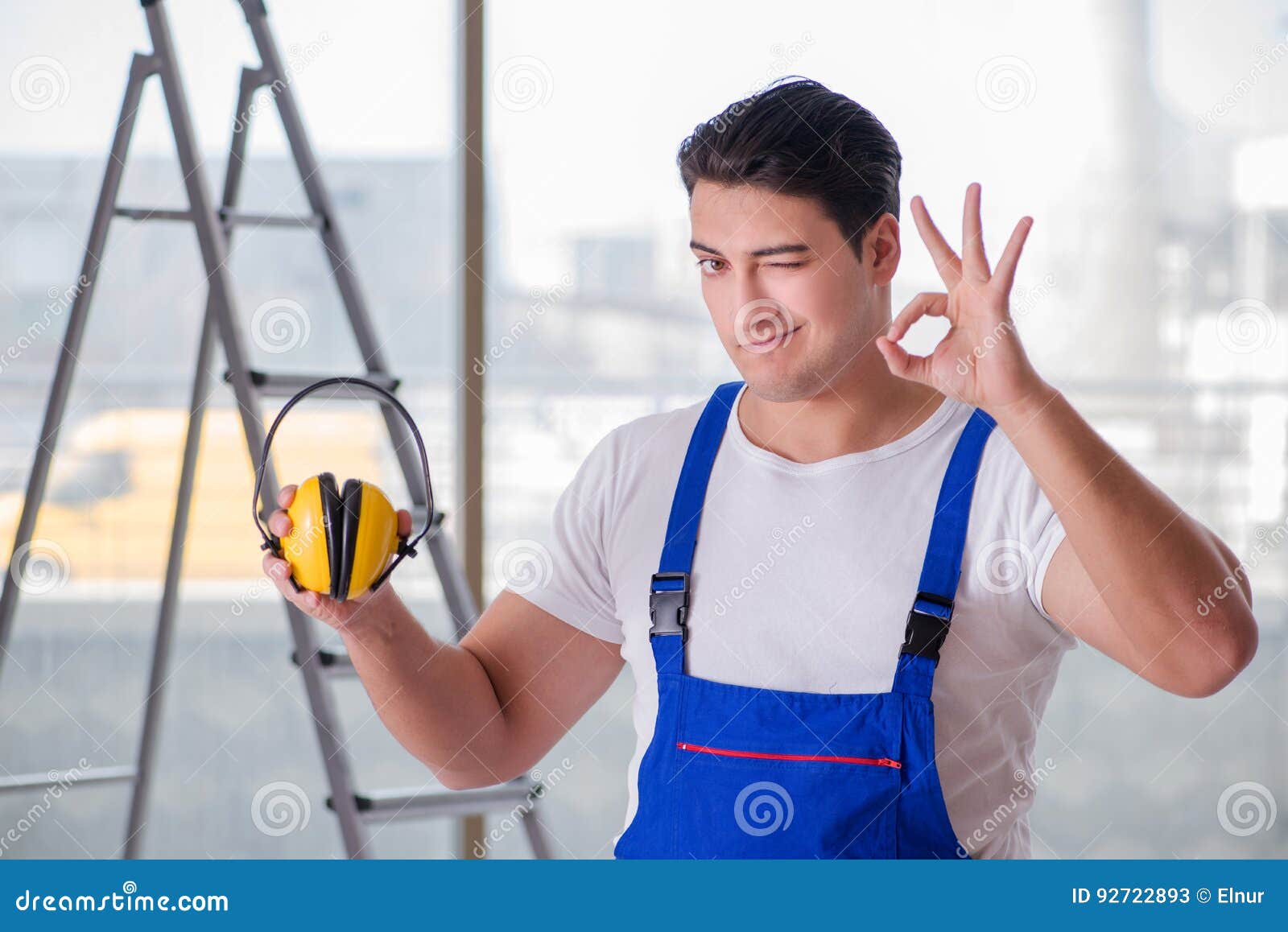 The Worker with Noise Cancelling Headphones Stock Image - Image of ...