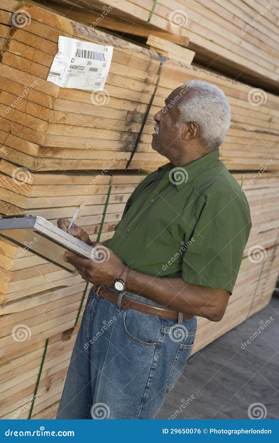 Worker Noting Down Information from Label Stock Photo - Image of ...