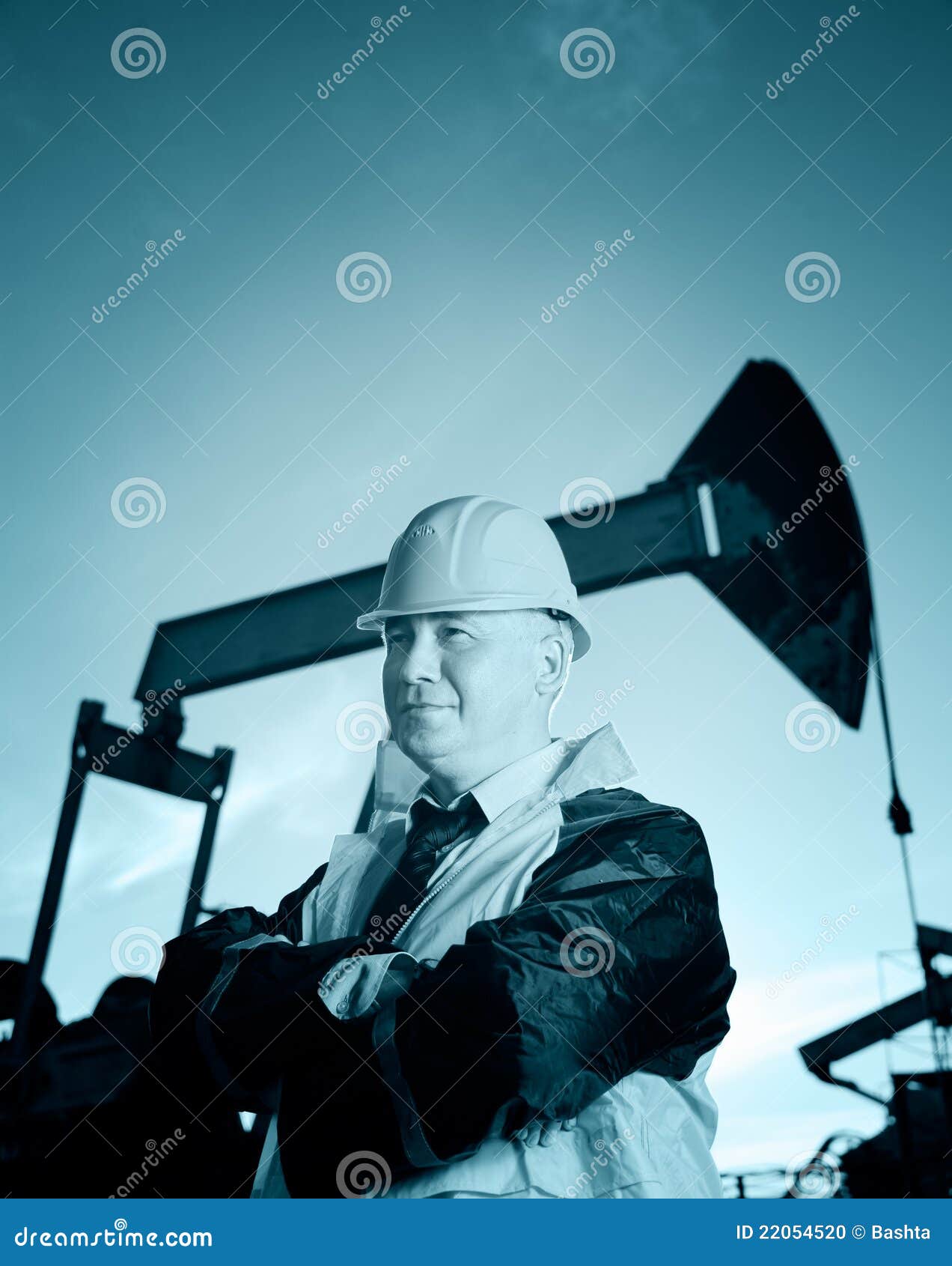 Worker in an Oil field stock photo. Image of industrial - 22054520