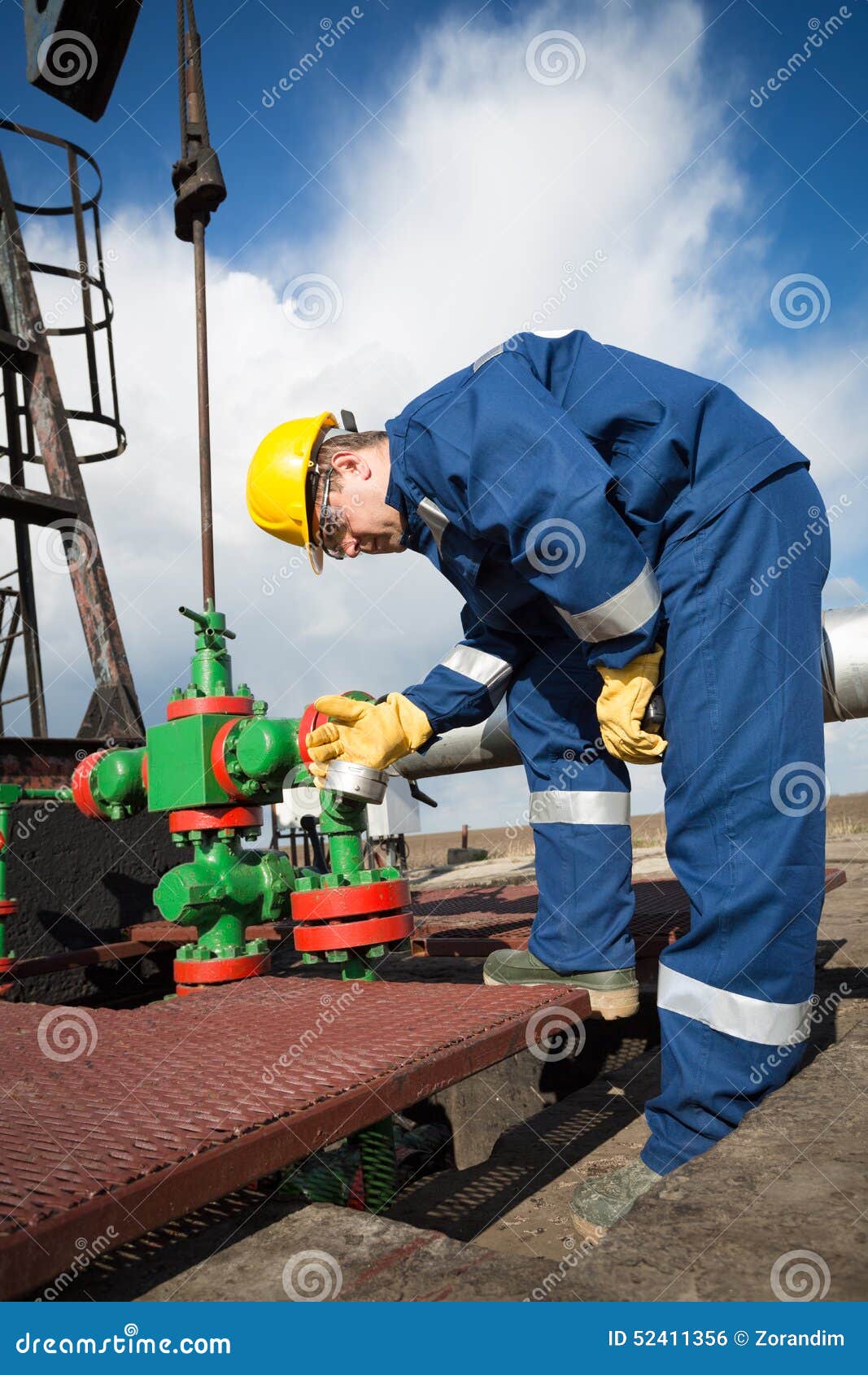 Worker on the oil field stock photo. Image of energy - 52411356