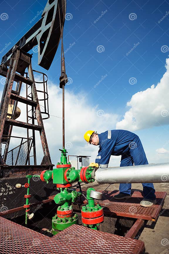 Worker on the oil field stock image. Image of industry - 52411685