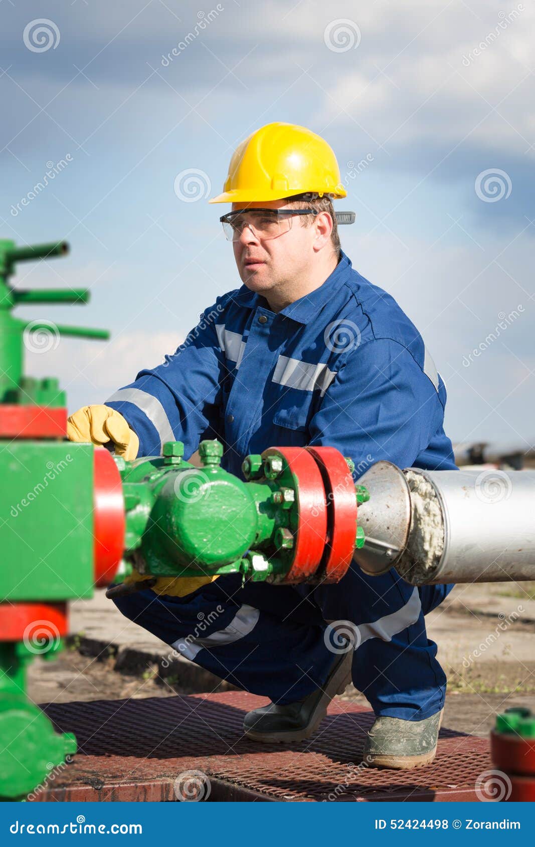 Worker on the oil field stock photo. Image of engineer - 52424498