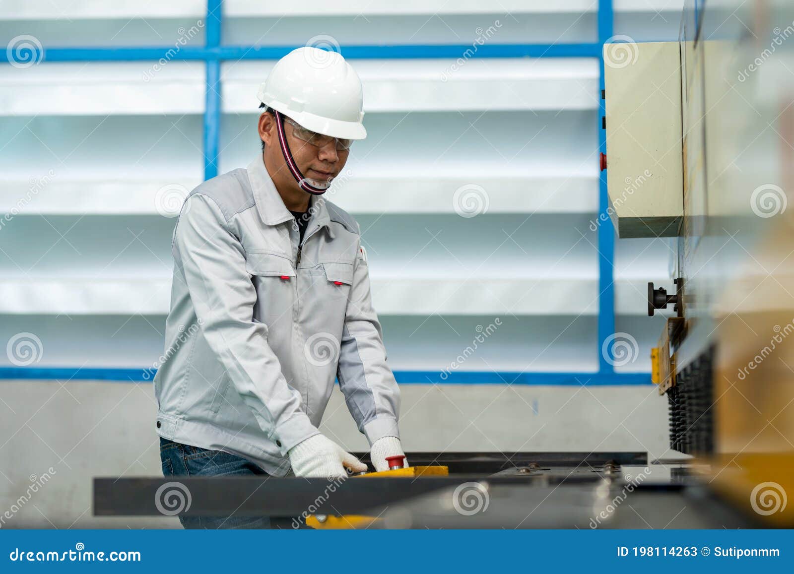 The Worker Operate Bending Machine in the Construction Machine Factory ...