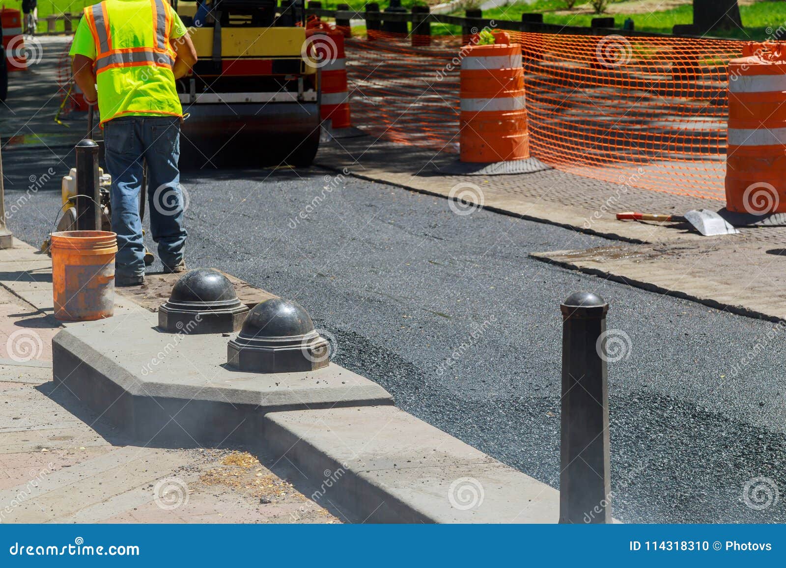 Worker Operating Asphalt Paver Machine during Road Construction ...